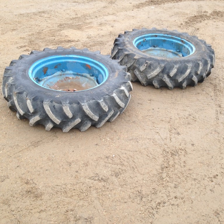 2 Tractor Tires 13.6x28 on Ford Rims and Centers