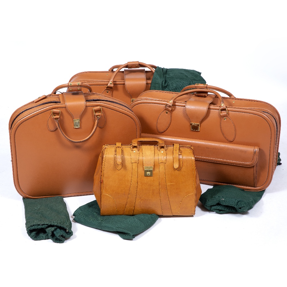 A GRADUATED SET OF THREE ITALIAN LEATHER SUITCASES by Schedoni of ...