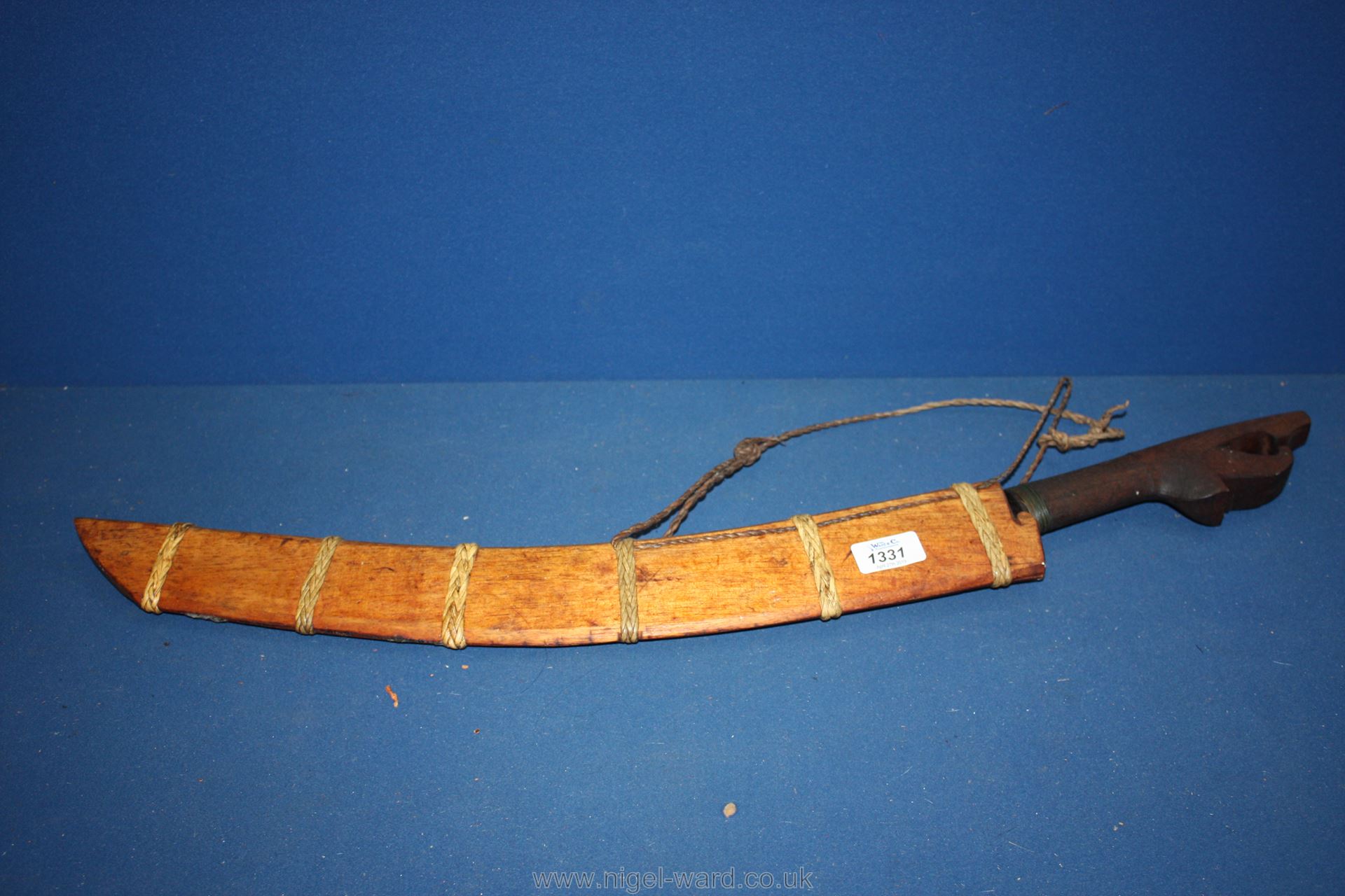 A steel curved bladed slashing Weapon having an unusual carved and ...