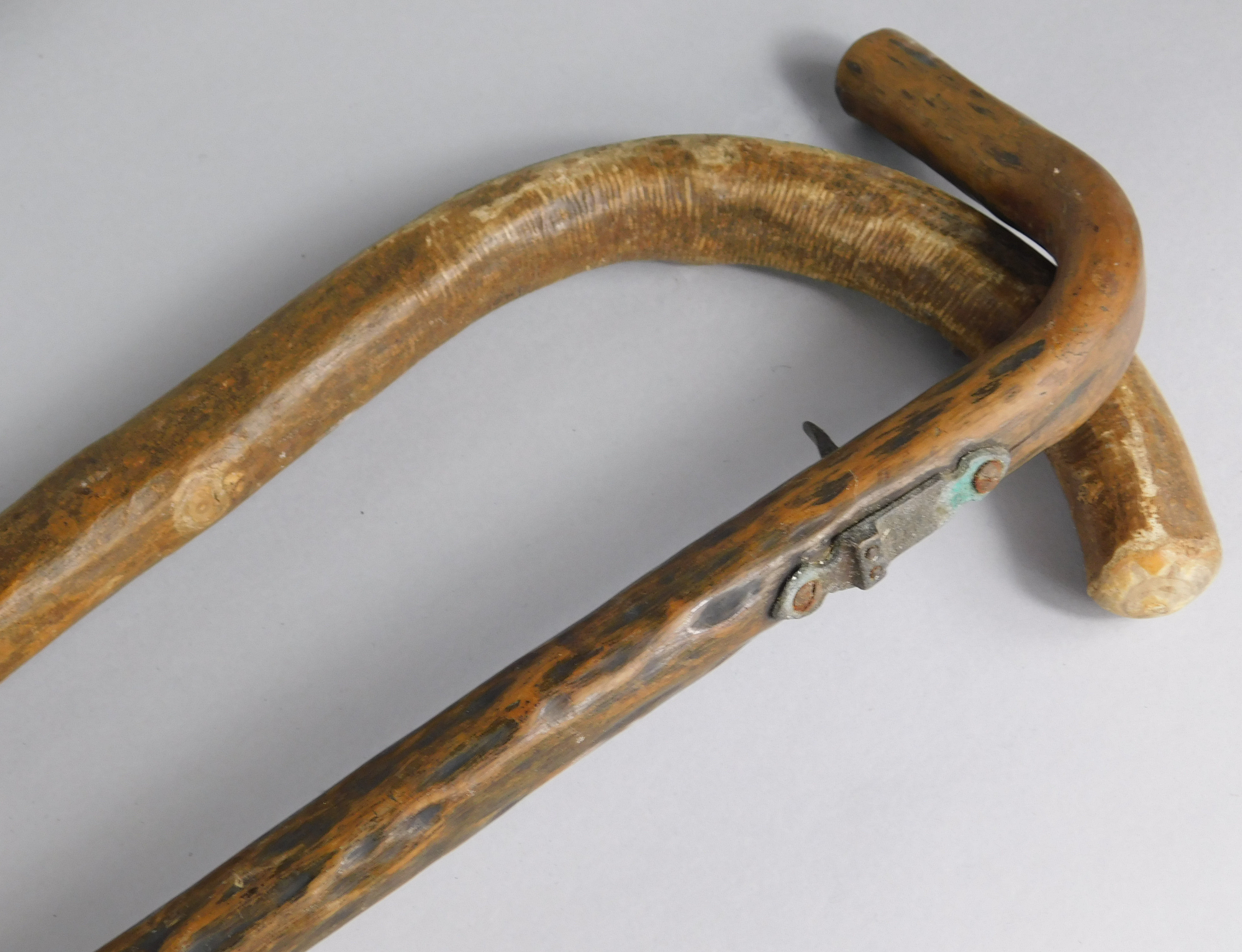 A collection of walking sticks, to include an example carved with a ...