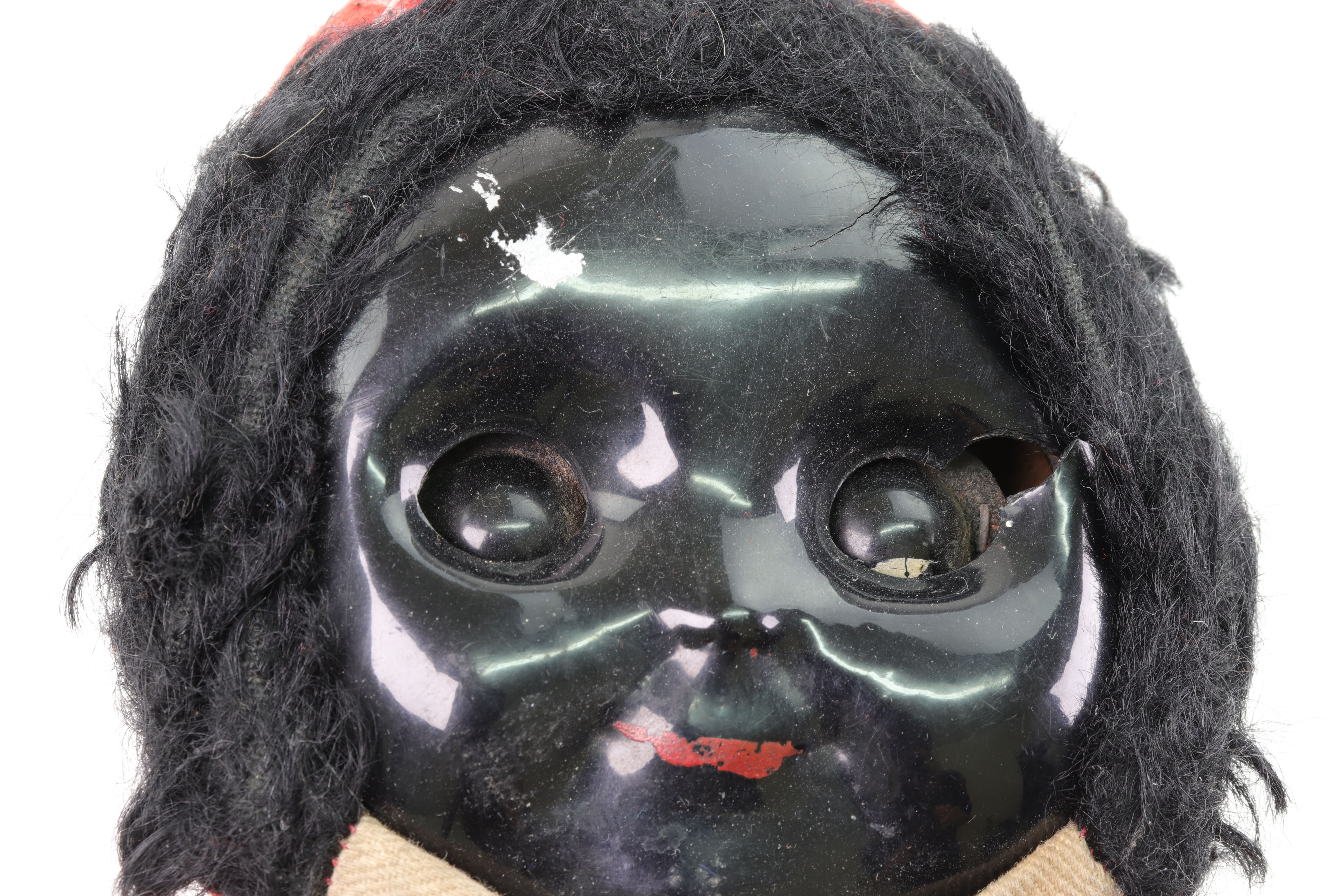 A vintage Golliwogg doll circa 1920's, painted pressed celluloid face ...
