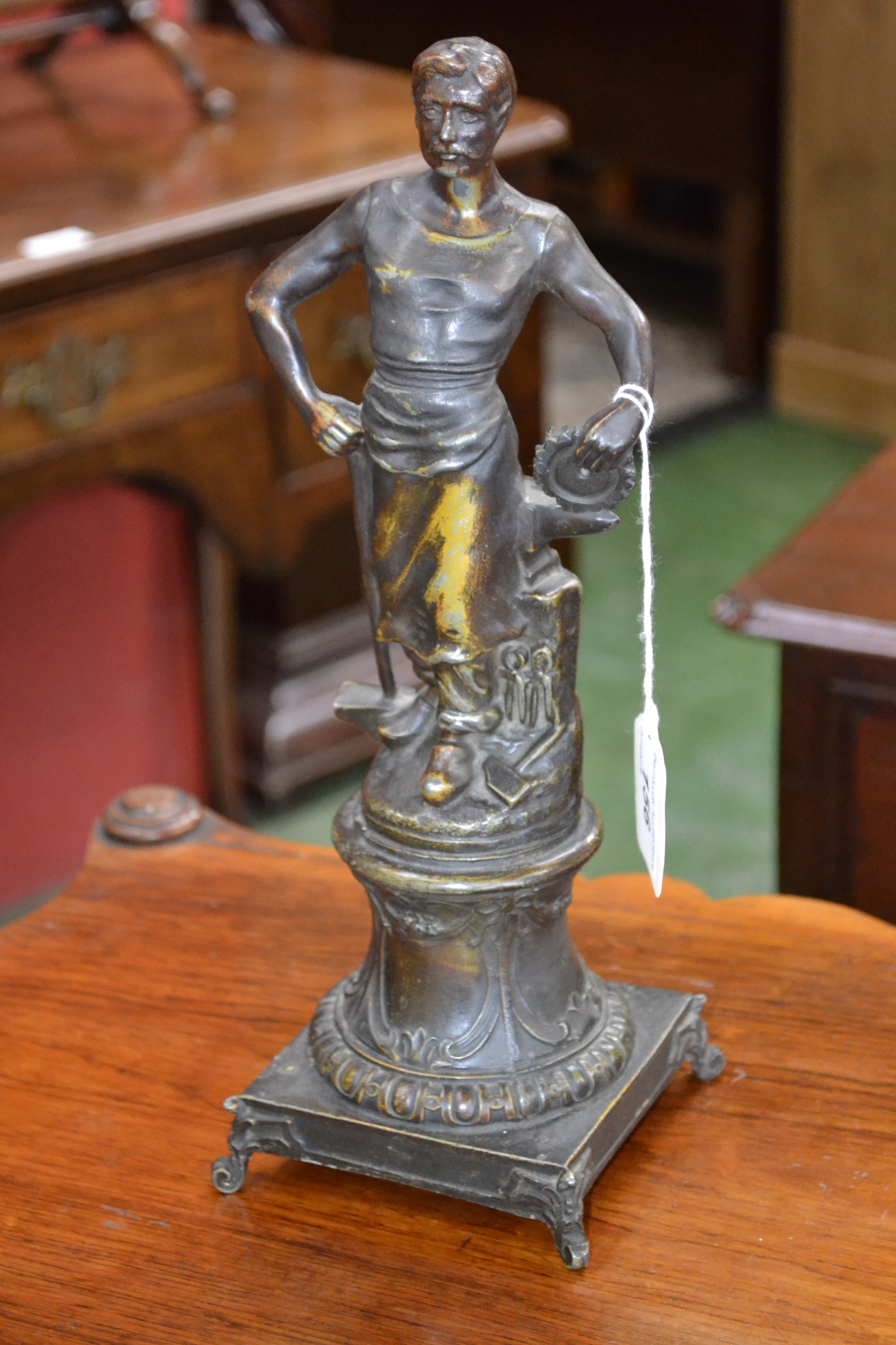 A 19th century spelter figure, The Blacksmith, signed A Rucho