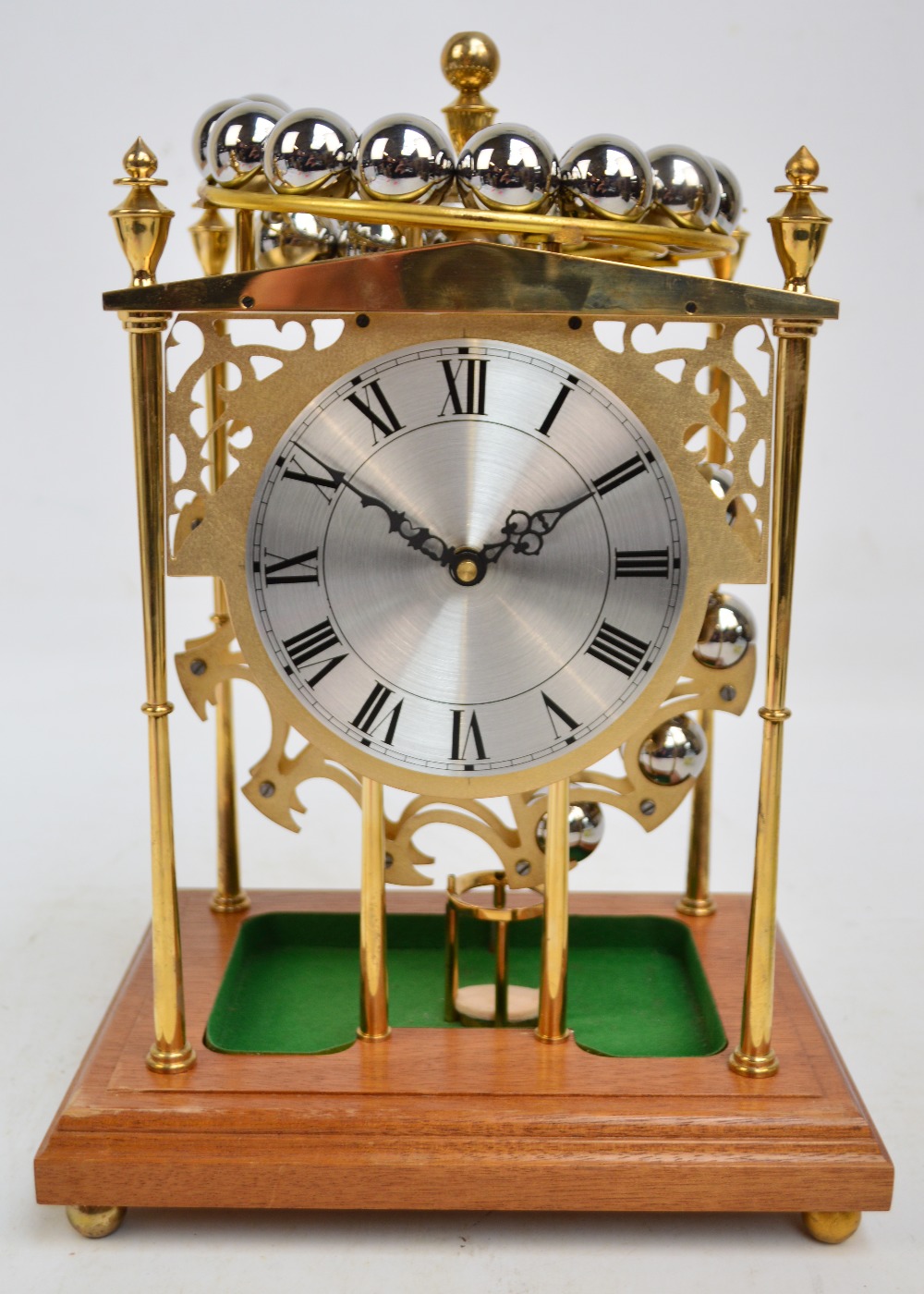A late 20th century falling ball clock or spherical weight clock, with ...