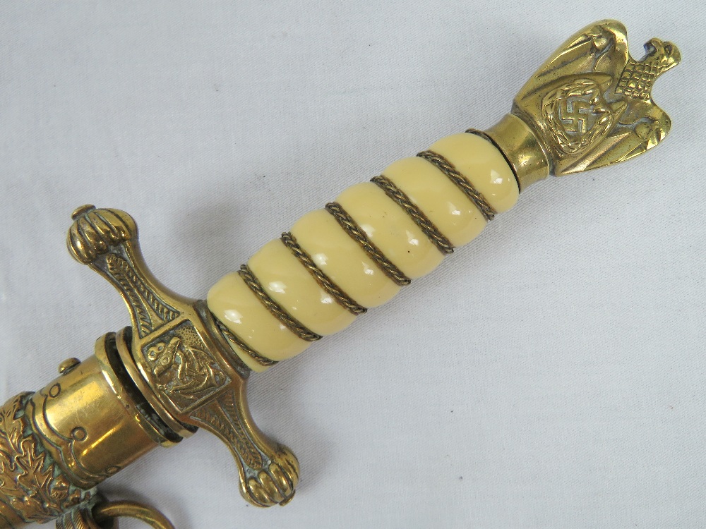 A WWII German Kriegsmarine Officers ceremonial dagger having decorative ...