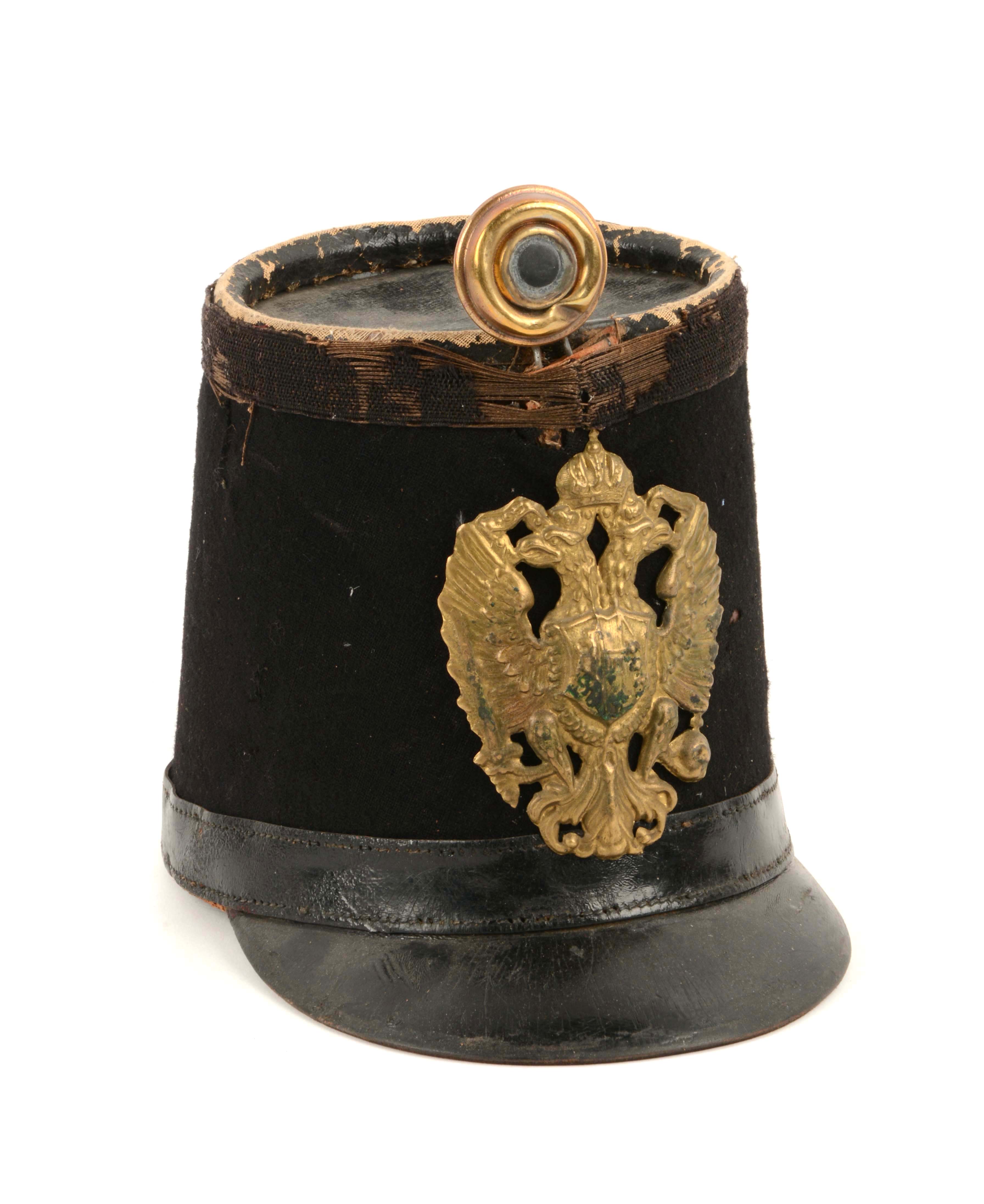 The black cardboard shako with black leather top and black tape around ...