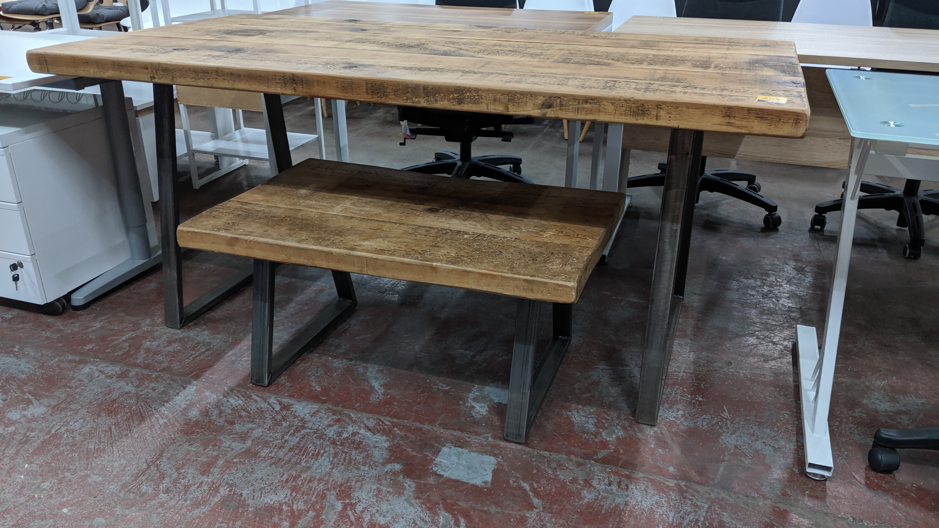 Pair of wooden tables on metal frames, the larger table having a top ...