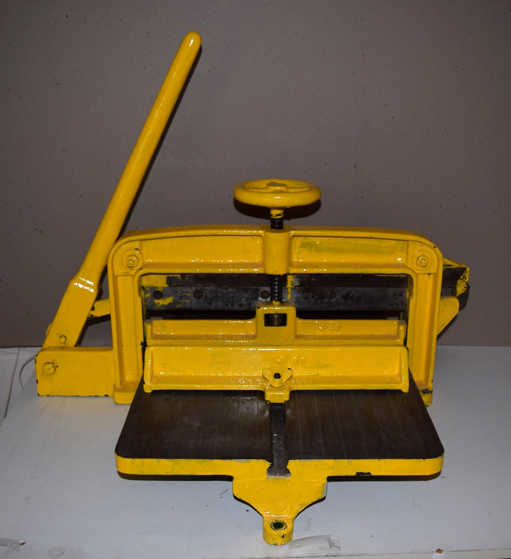 *Guillotine. A small bench-standing guillotine by Hampson Bettridge ...