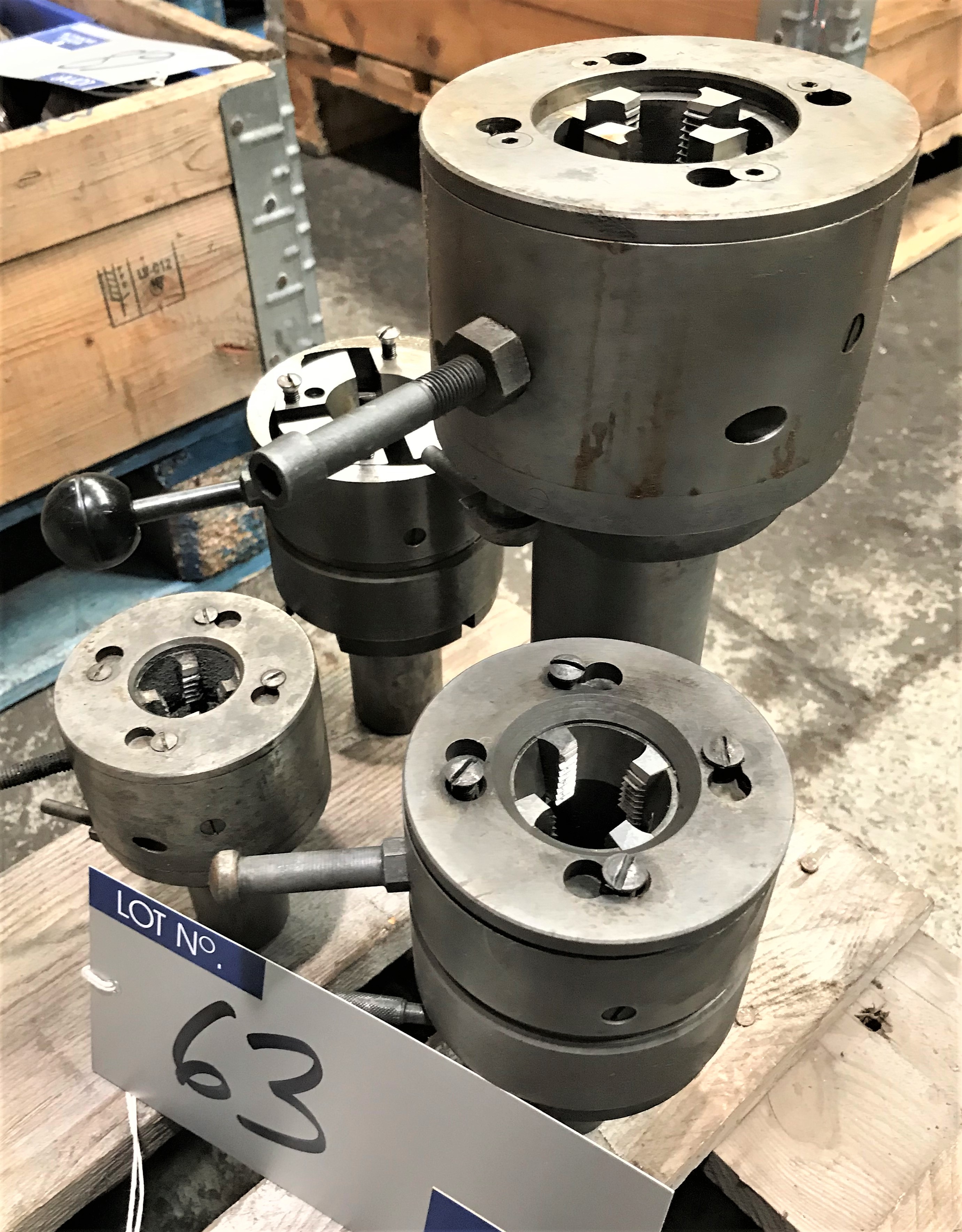 3 Die Heads, 1-2.5in, 1-1.75in, 1-1.25in with An Adjustable Die Head.