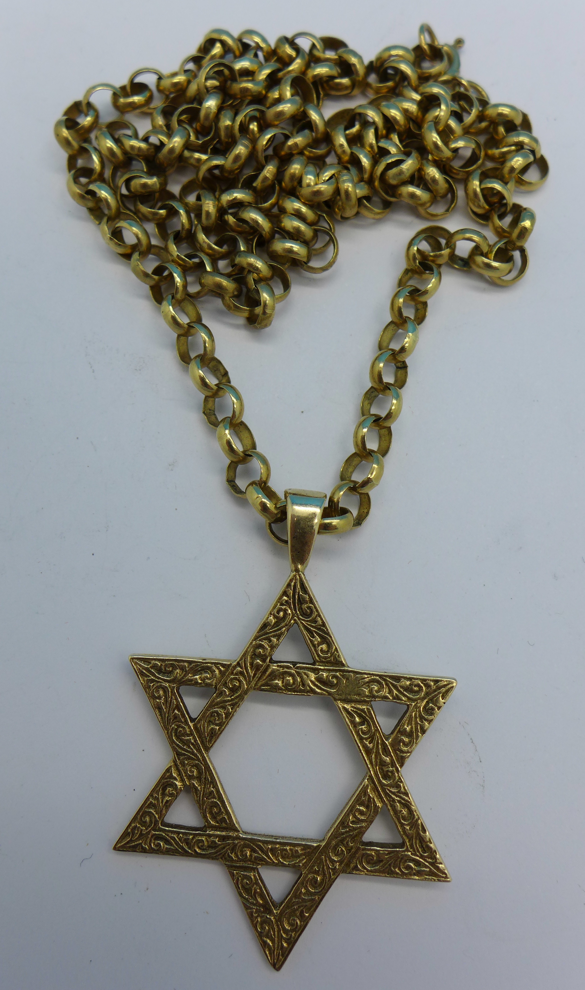 A 9ct gold Star of David pendant on a 9ct gold chain, 24g