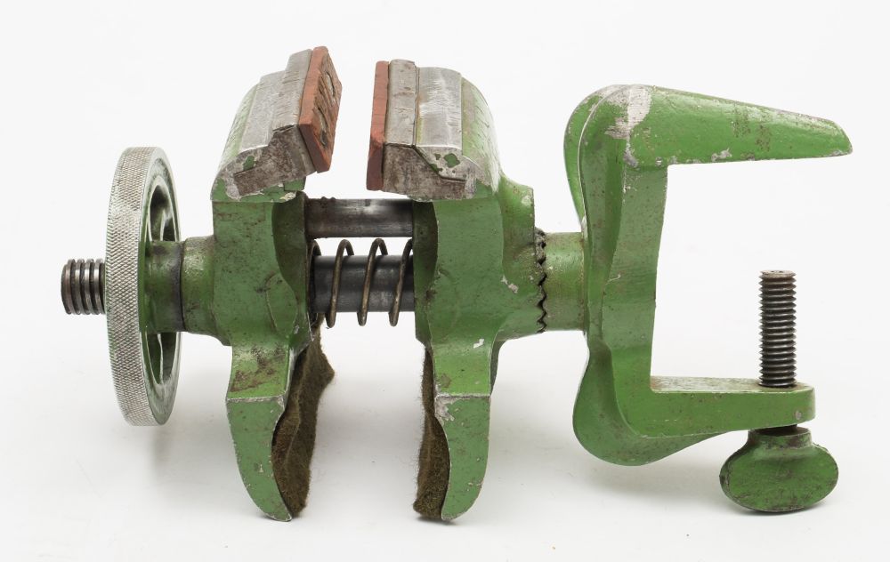 A Parker Hale 'The Bisley Rifle Vice':, in green with table clamp and ...