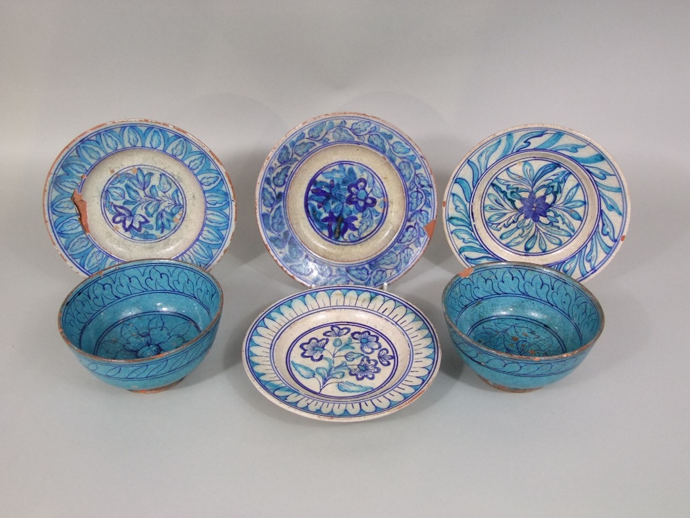 A collection of middle eastern pottery wares with blue and turquoise ...