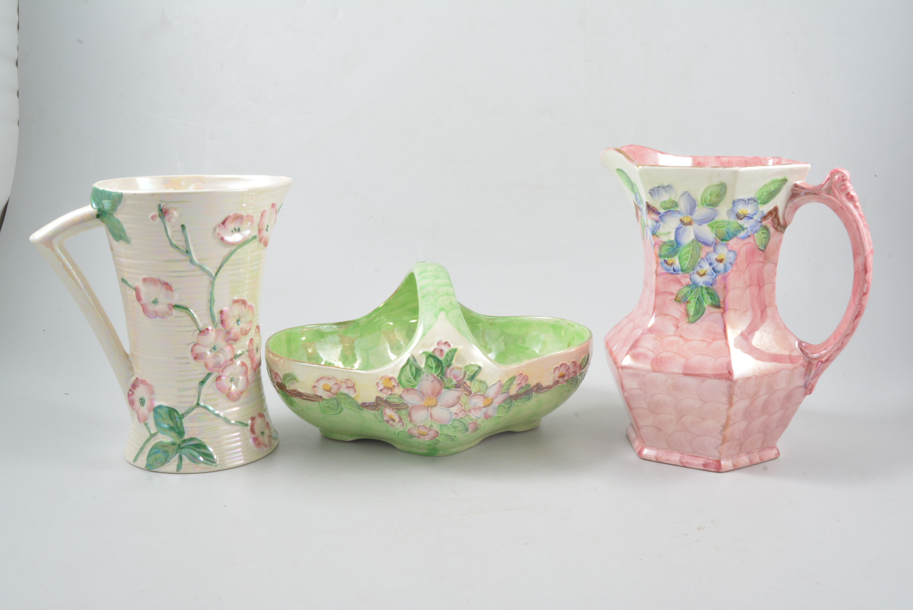 Maling thumbprint lustre ware, a 20cm pink hydra shaped jug, two oval ...