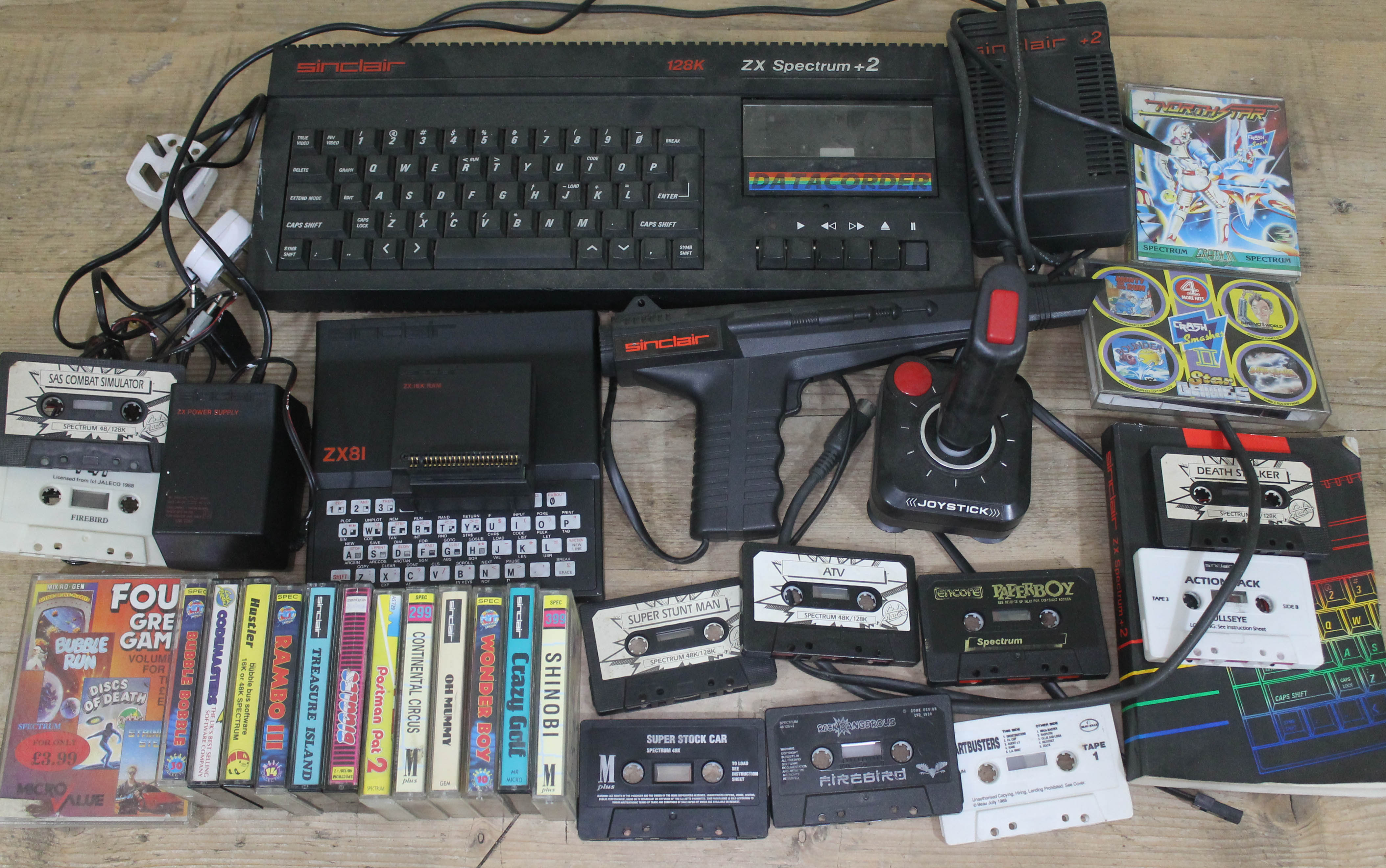 A Sinclair ZX Spectrum ZX81 and ZX Spectrum +2 with various games and ...