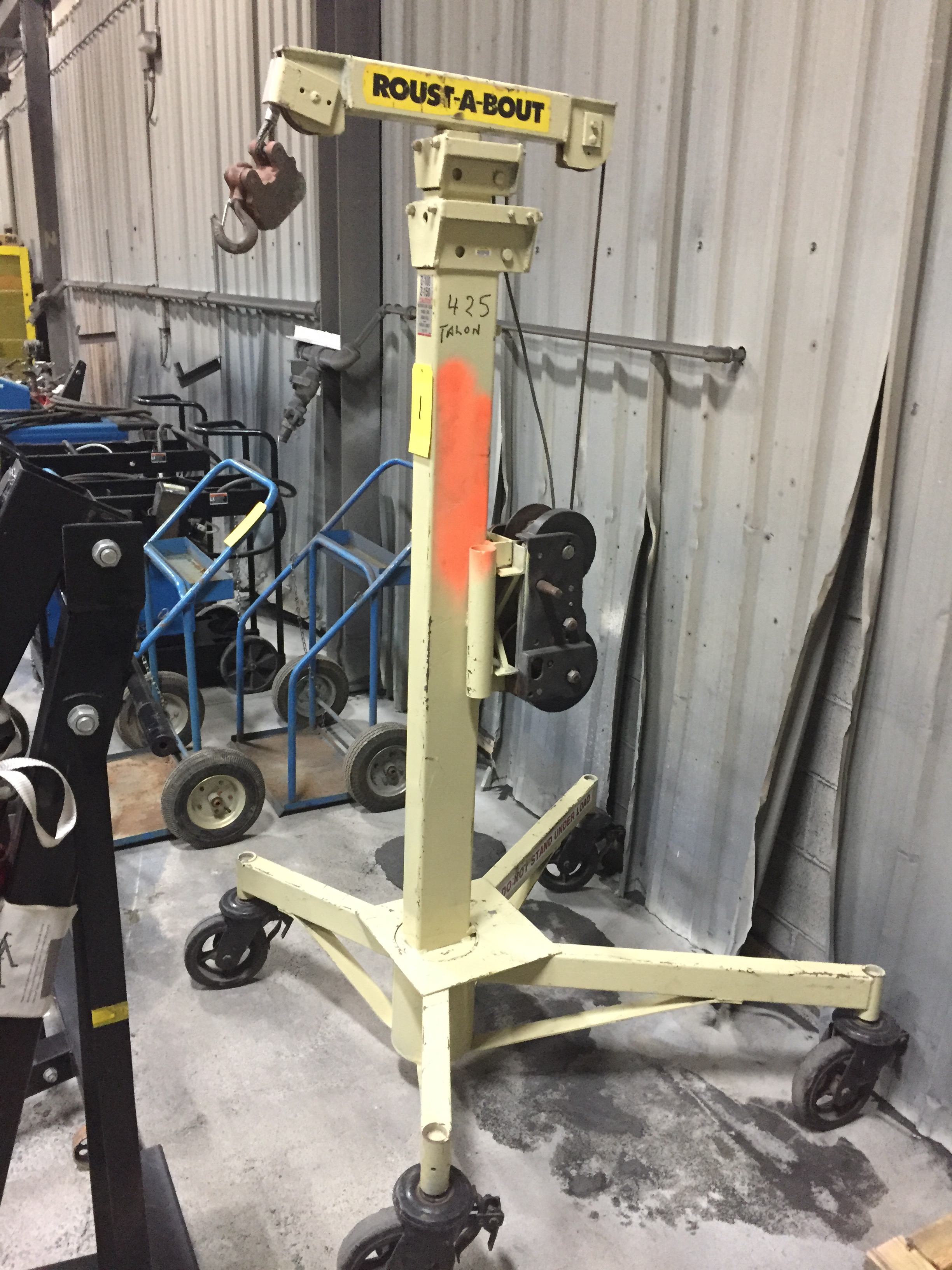 ROUST-A-BOUT MANUAL HOIST WITH 1,500 LB. CAPACITY & 15' REACH (LOCATED ...