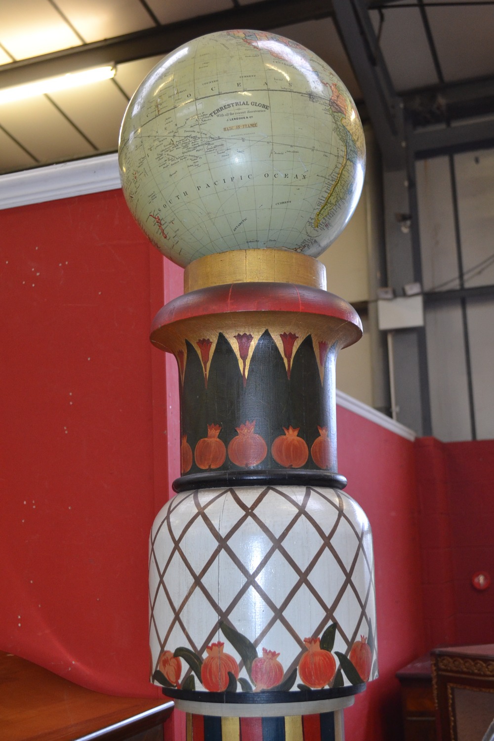 A pair of Masonic columns, world globe surmounting architectural ...