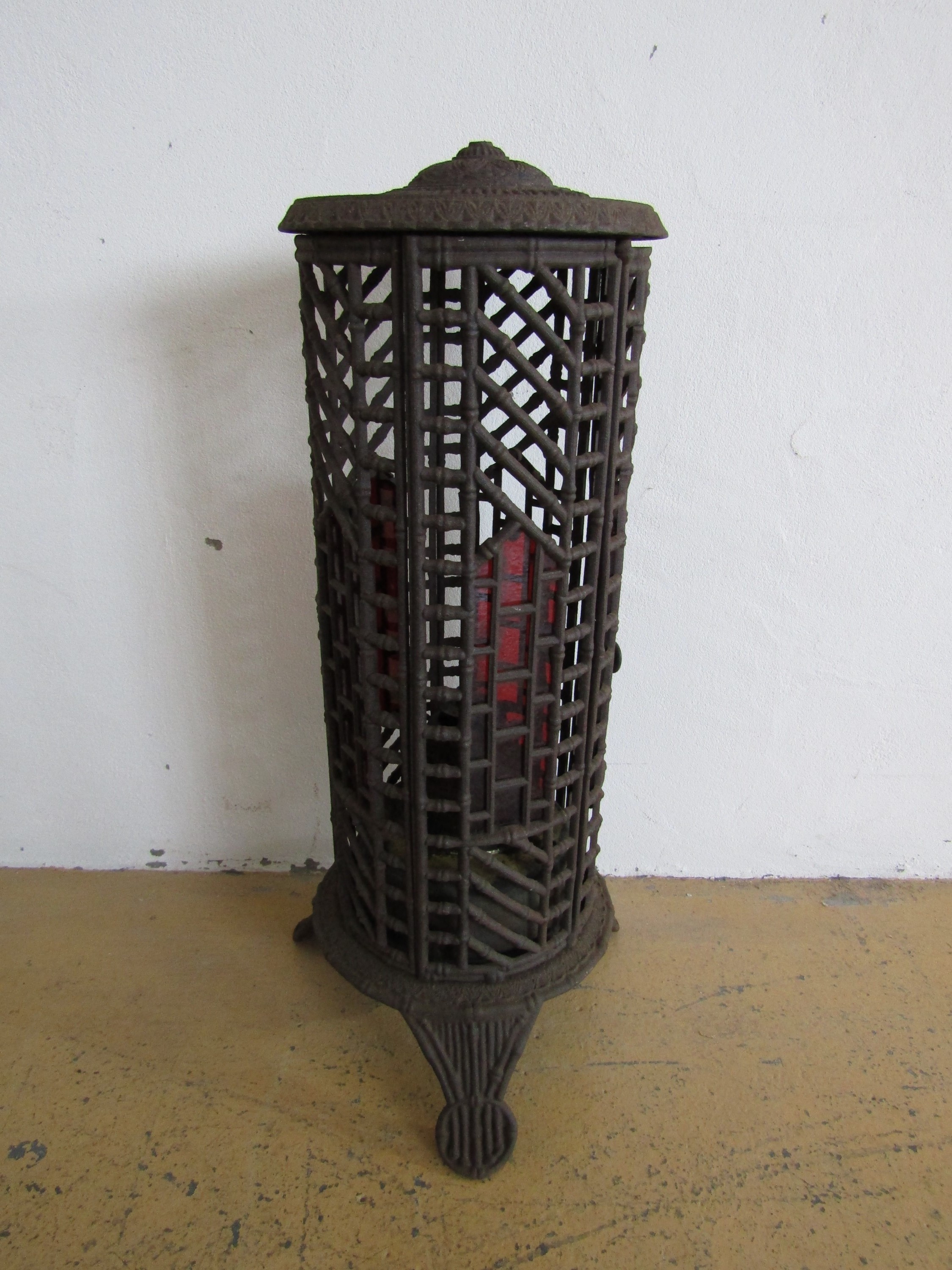 A Victorian cast iron paraffin conservatory heater, cast in an ...