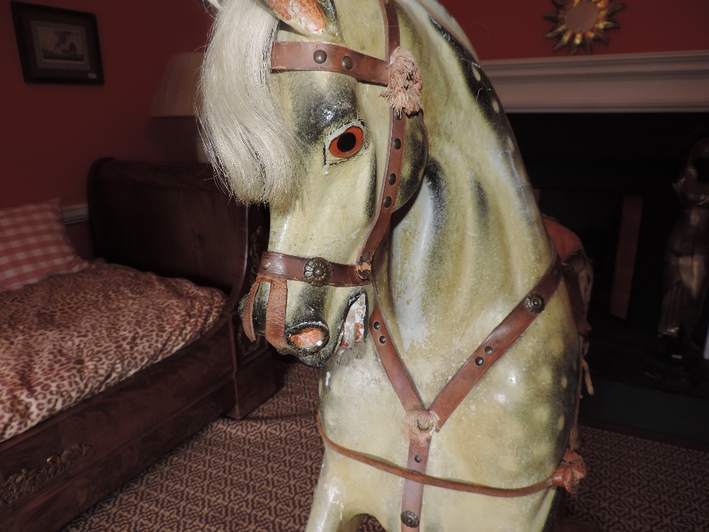 A fine large Victorian carved and painted wooden Rocking Horse, with ...