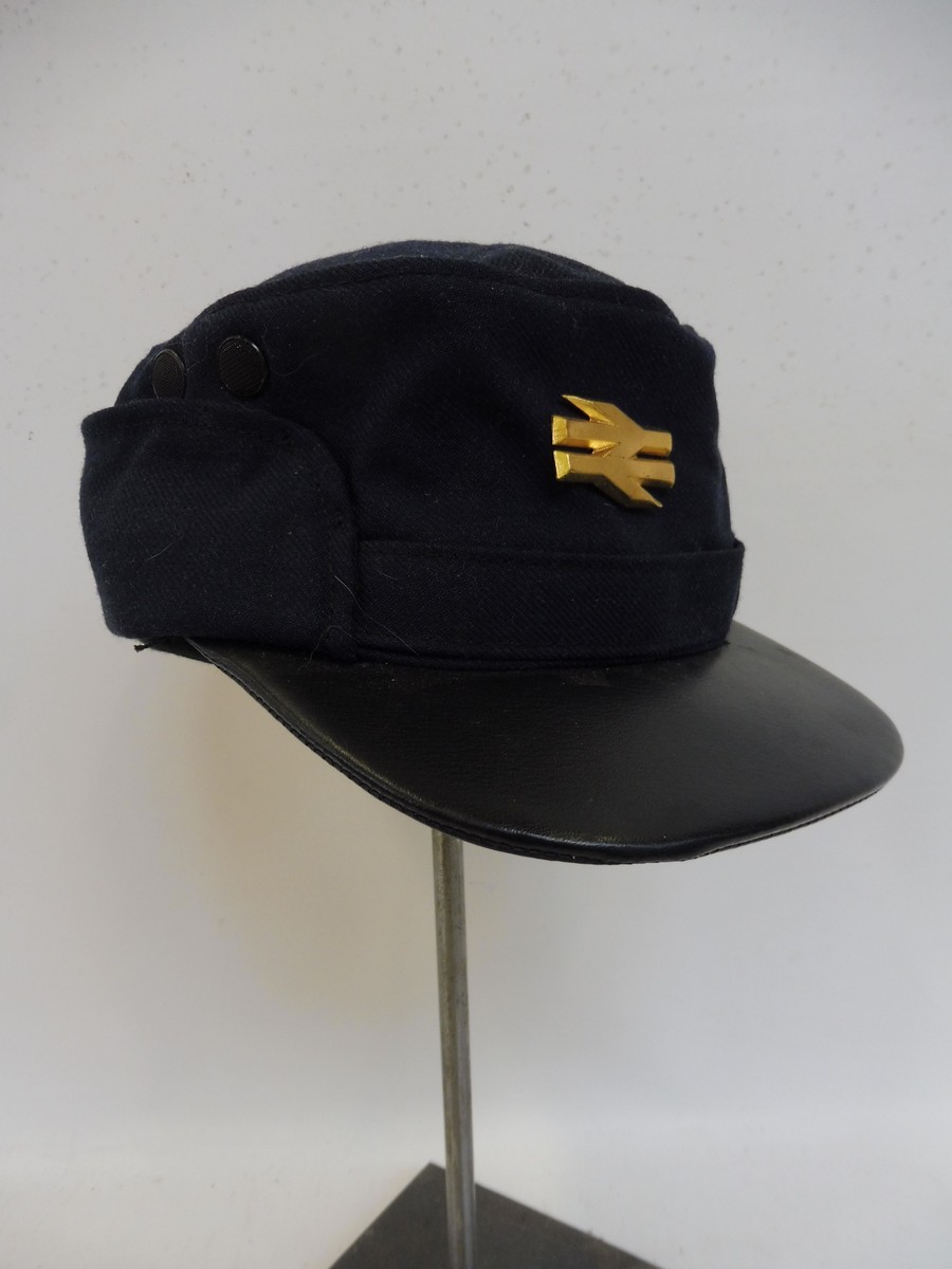 A steam train driver's cap, by repute worn by Reginald Beasley, bearing ...