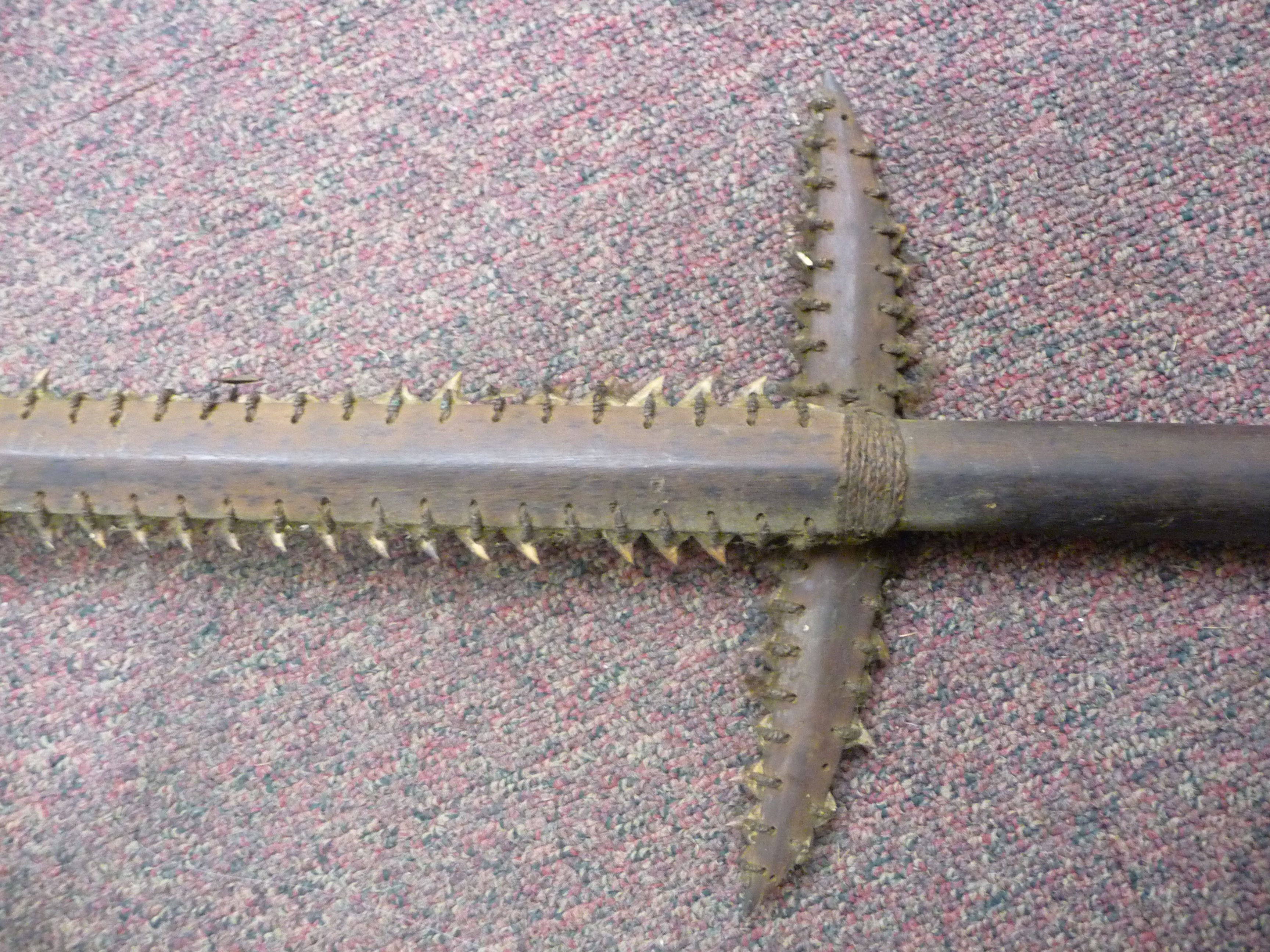 A Pacific Islands native, hand held wooden sword-like weapon, set with ...