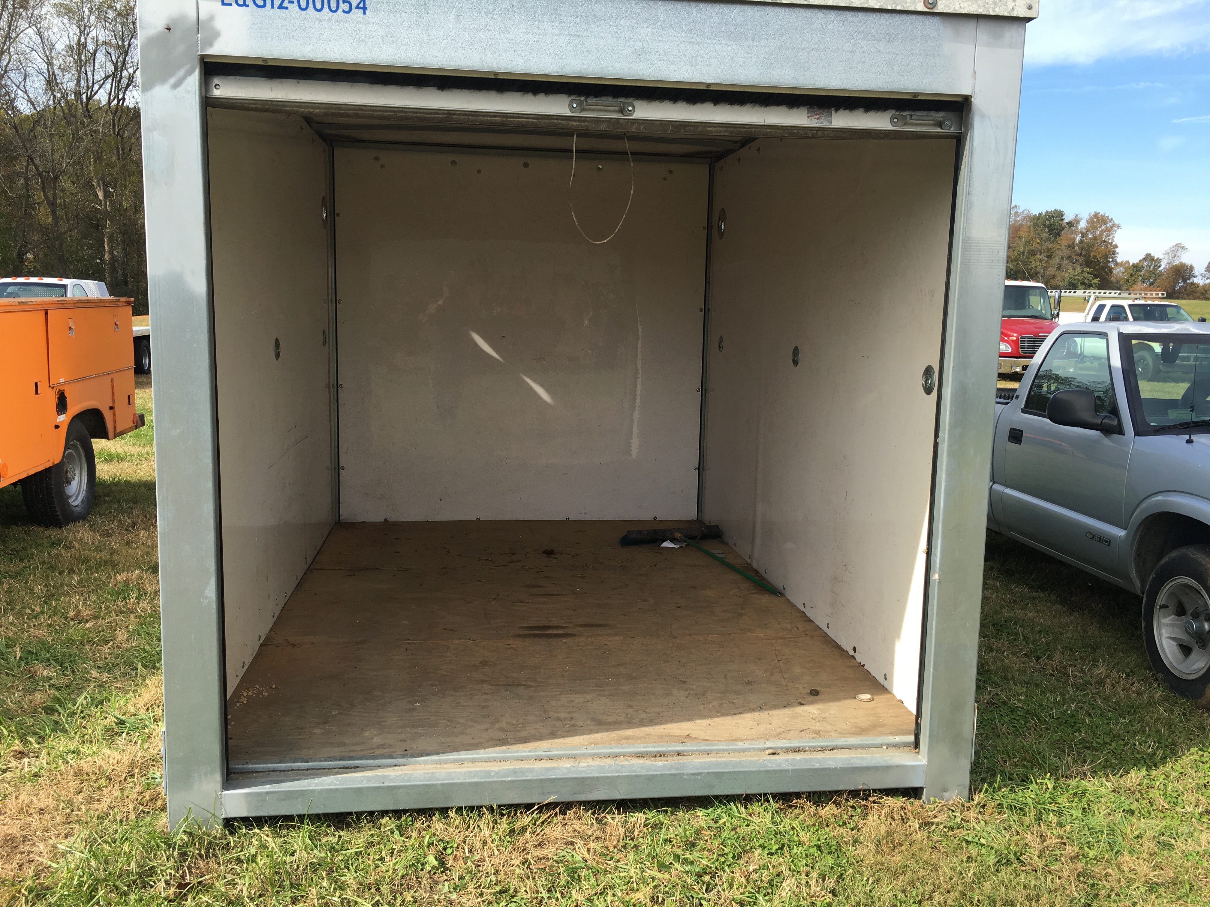 12 ft pod box with roll up door . has a small hole on left side see pic ...