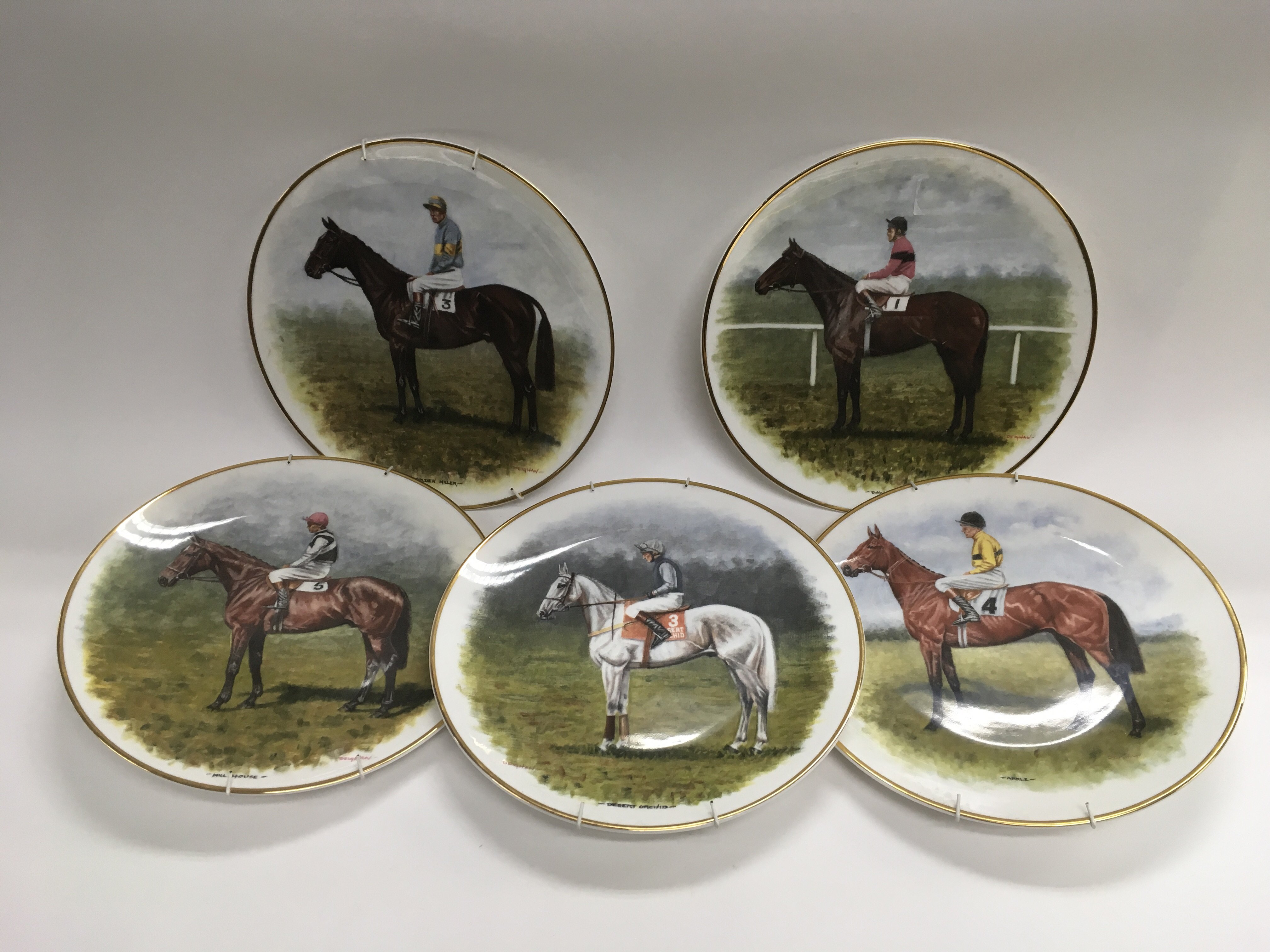 Five limited edition horse racing plates.