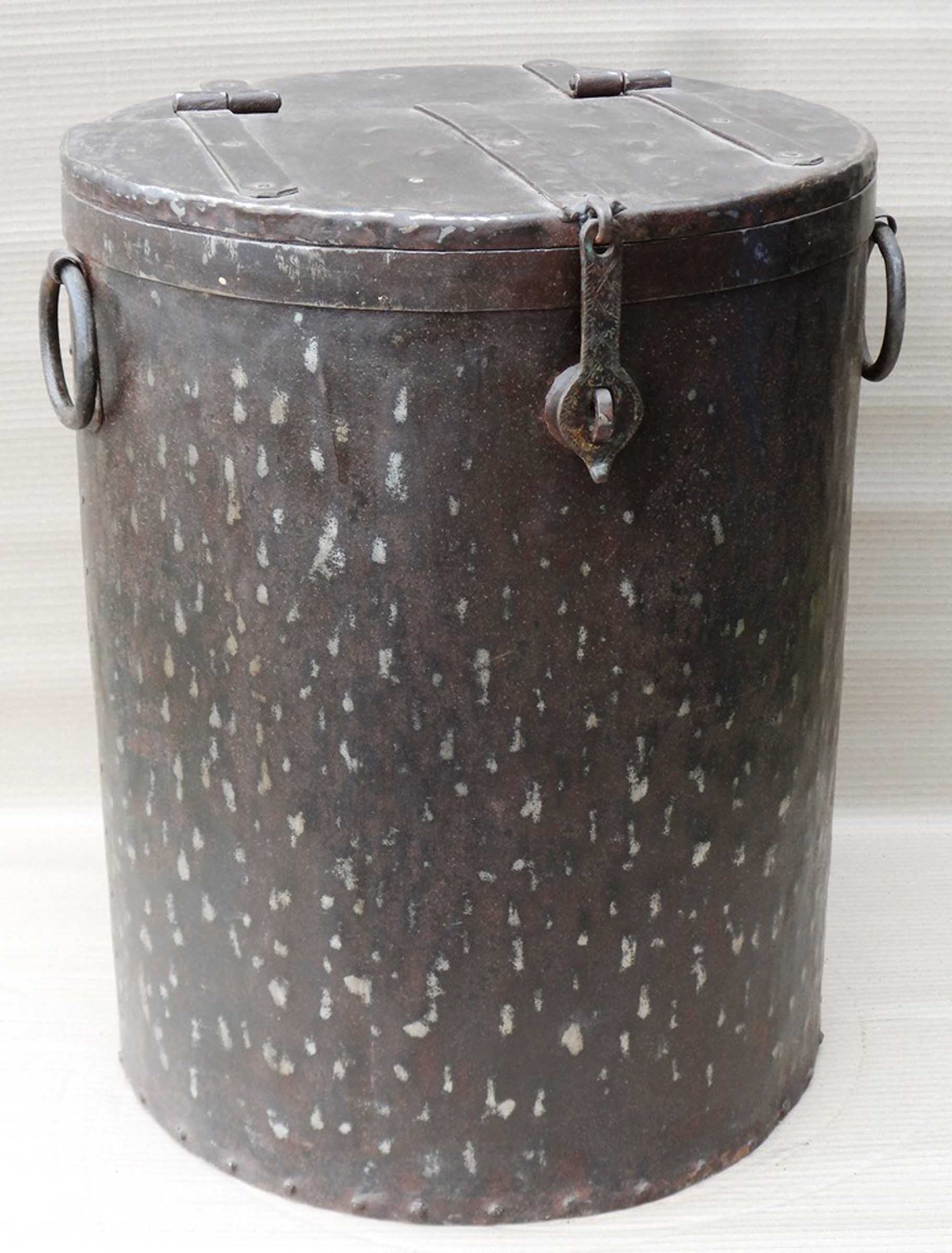 Large round metal bins with lids.