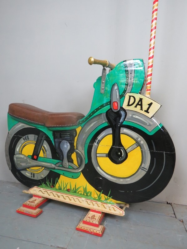 A fantastic mid-century, vintage, fairground carousel motorcycle, with ...