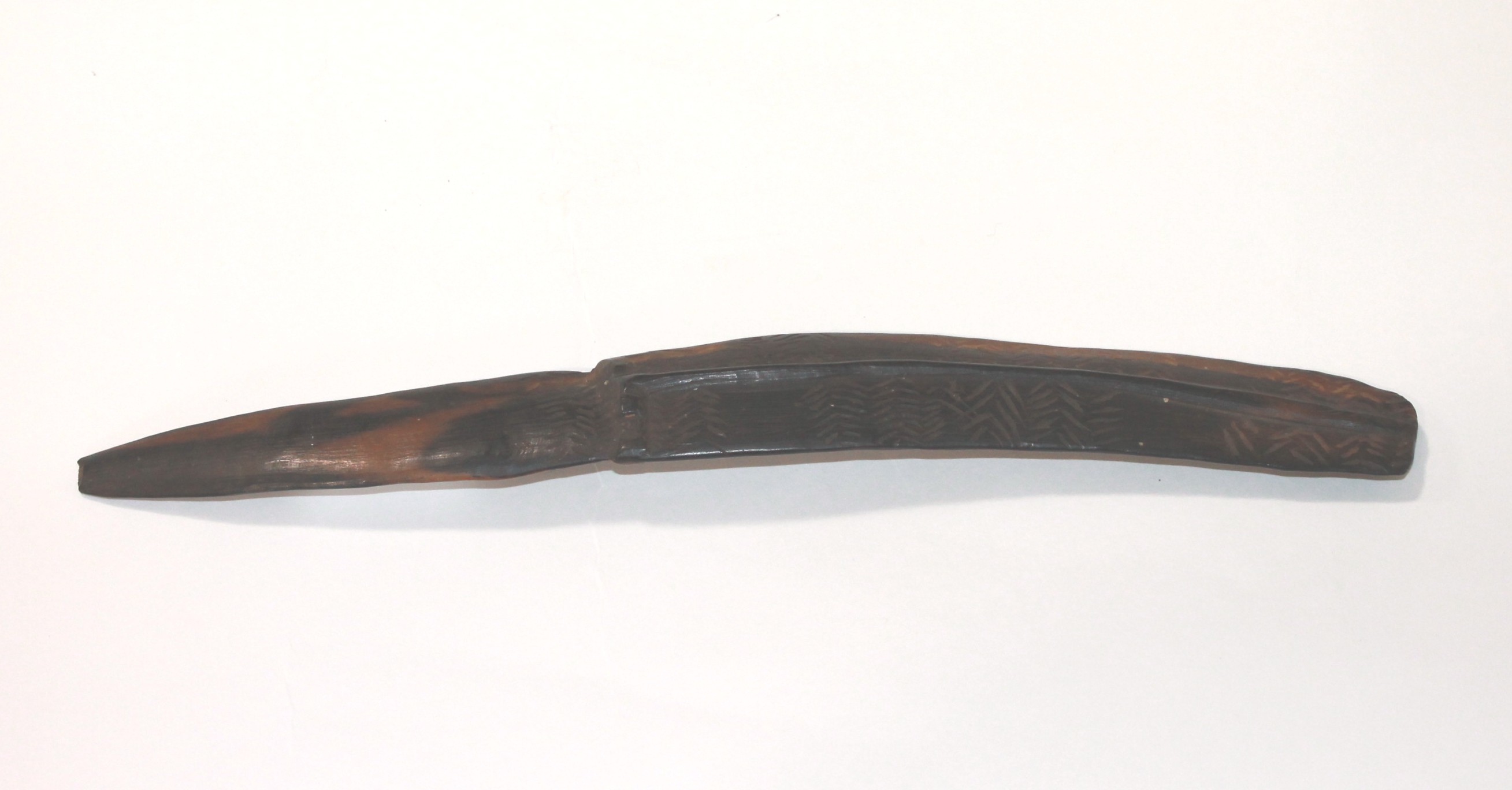 AN ABORIGINAL KNIFE. A carved bi-wood Aboriginal knife, with centre-rib ...