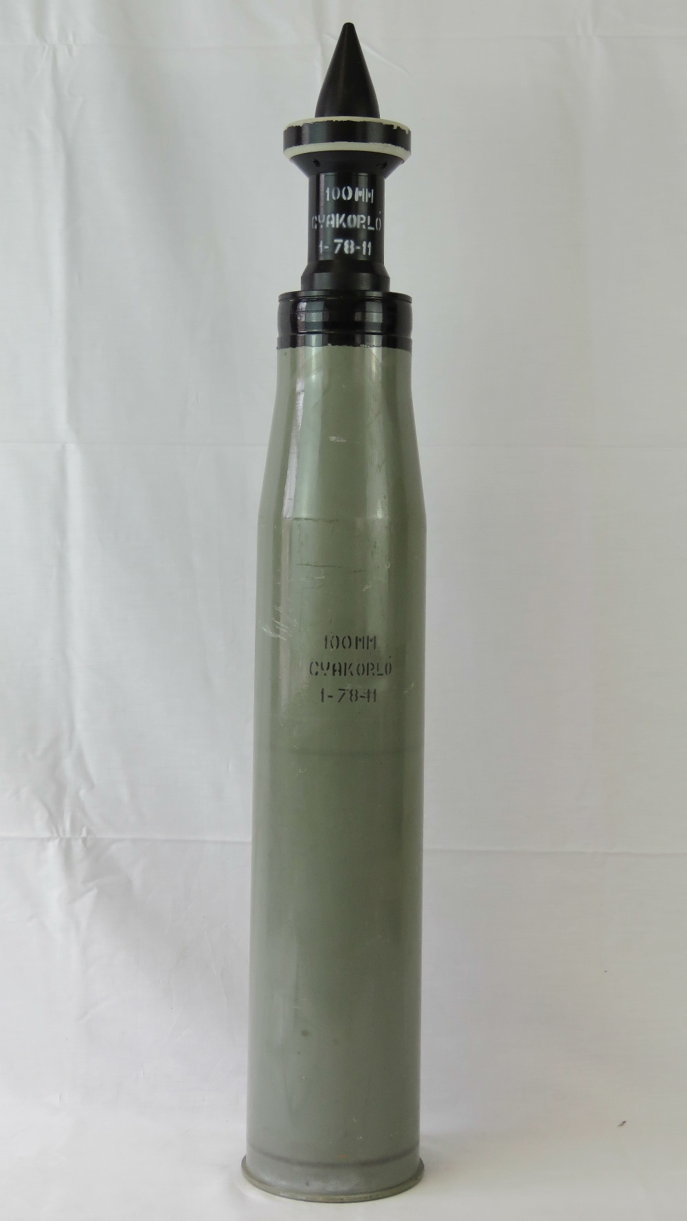 An inert Soviet 100mm T55 Armour piercing tank training round, 92cm high.