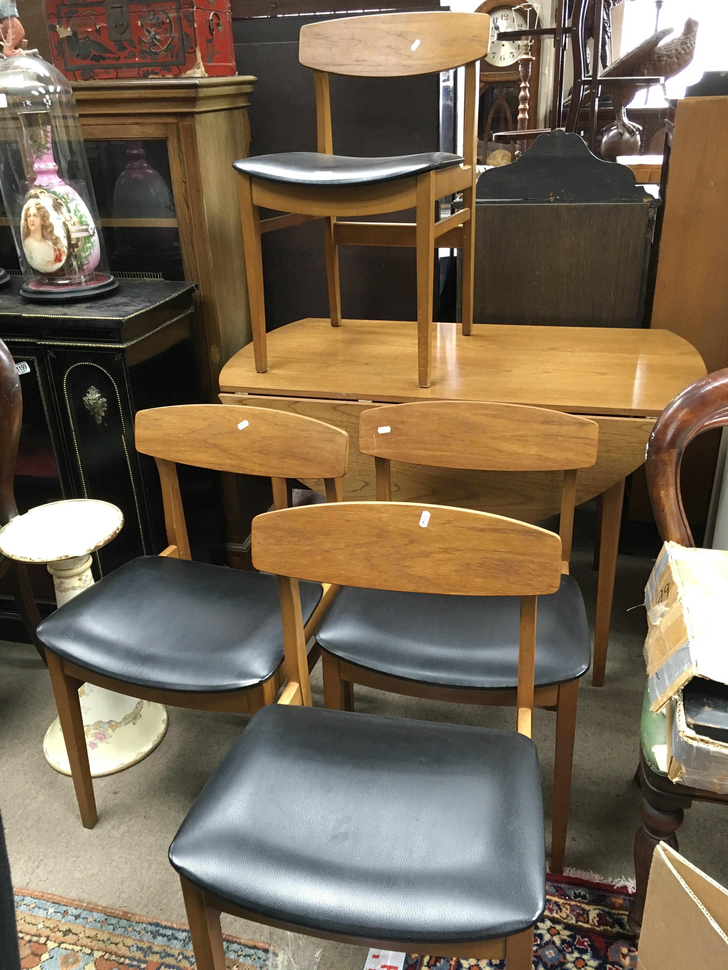 A Beautility teak dining room suite comprising a drop leaf table, four ...