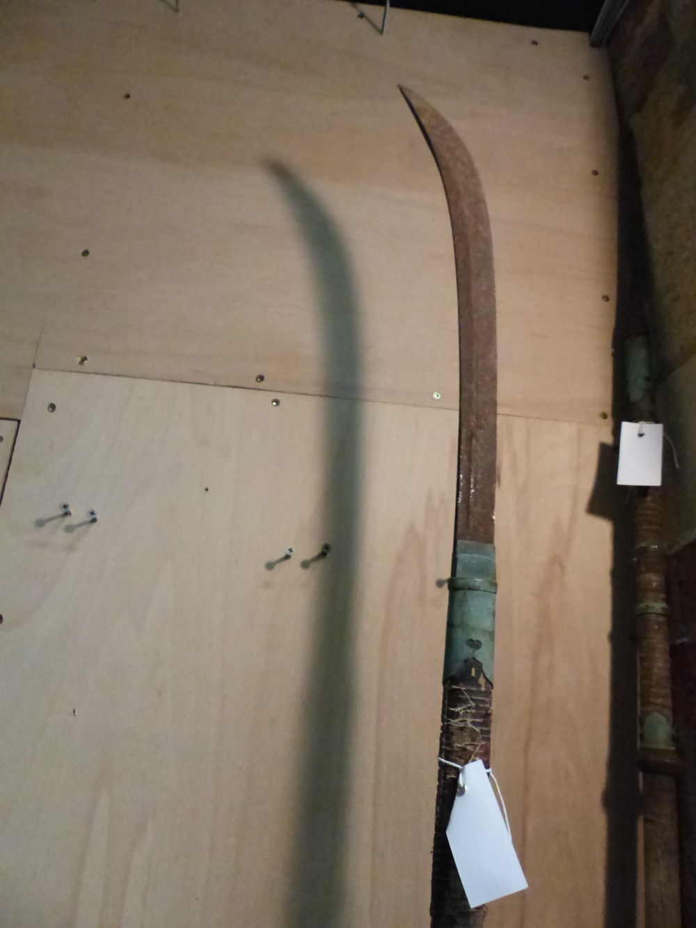 TWO JAPANESE POLEARMS, A NAGINATA WITH CURVED HEAVY TIPPED BLADE AND ...