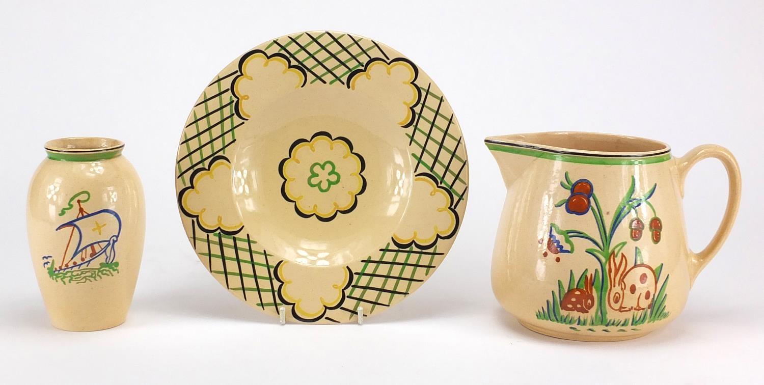 Three pieces of Ashtead pottery comprising a jug, vase and dish, each ...