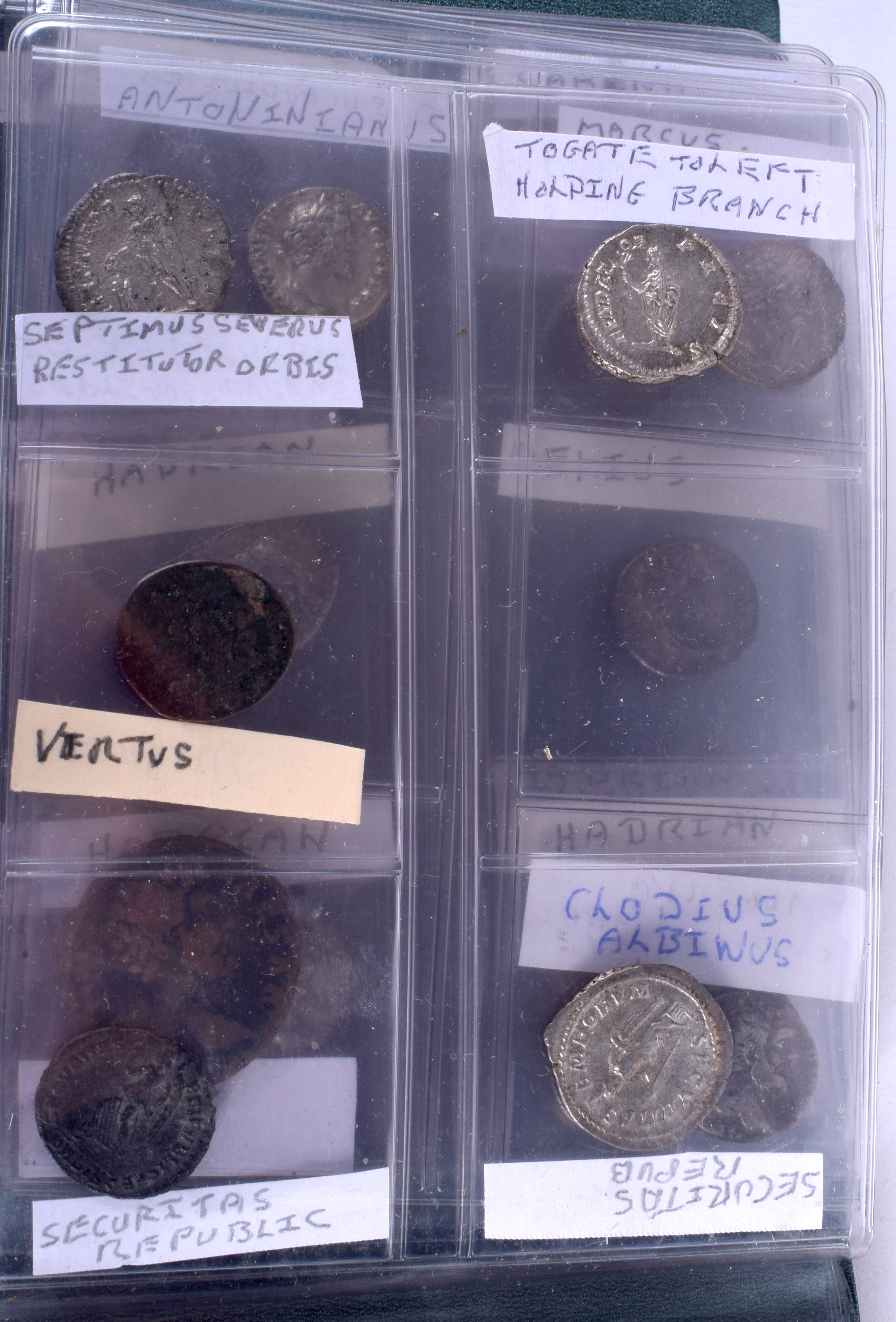 A COLLECTION OF ROMAN COINS together with a Roman coin identification ...