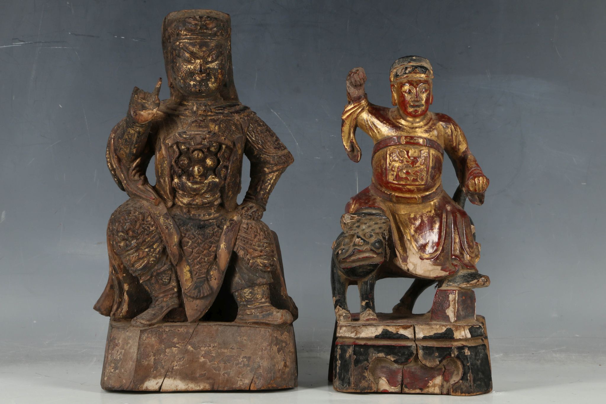Two Chinese carved wood temple figures, one depicting a seated figure ...