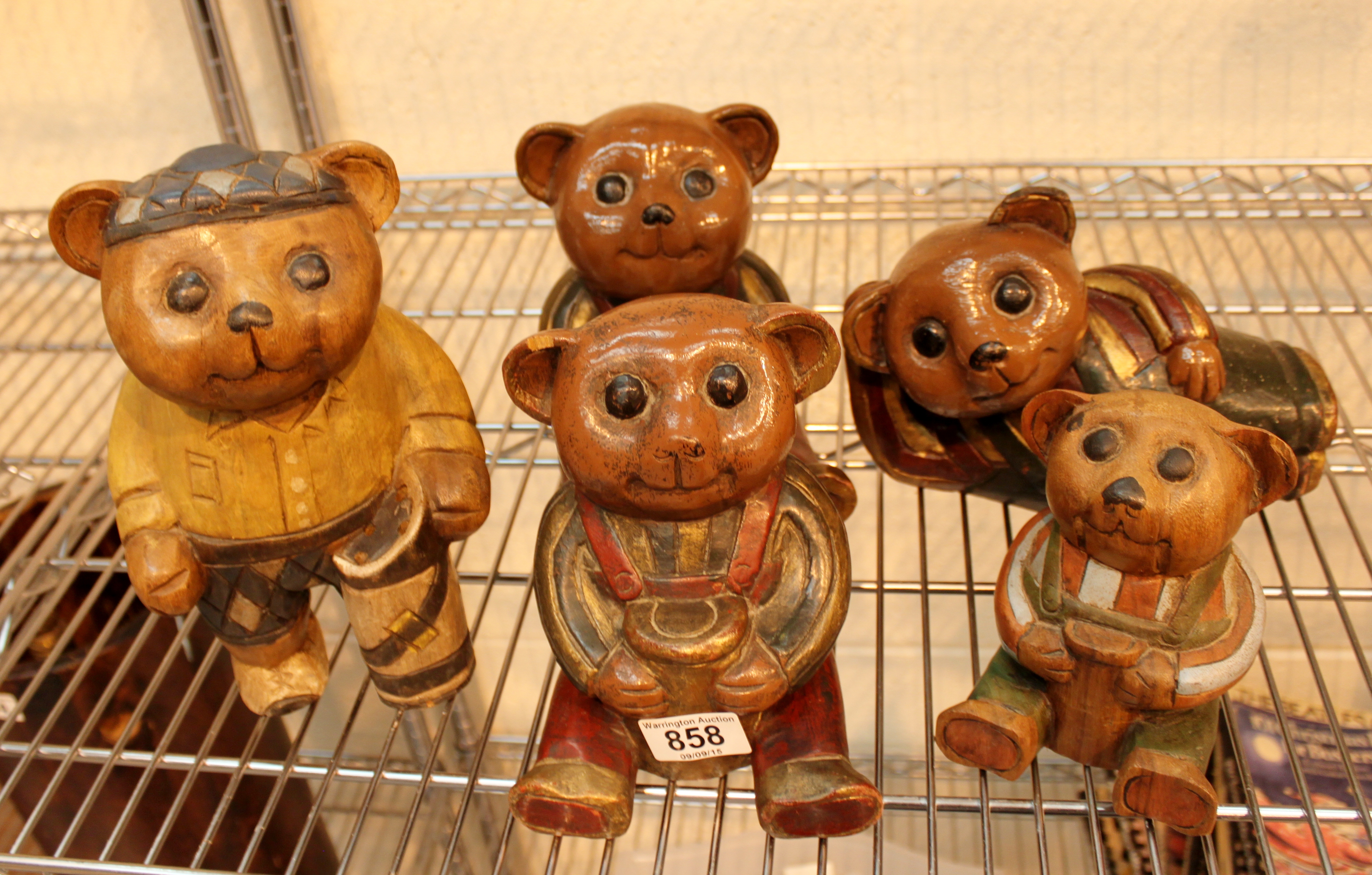 Five carved wooden hand painted bears