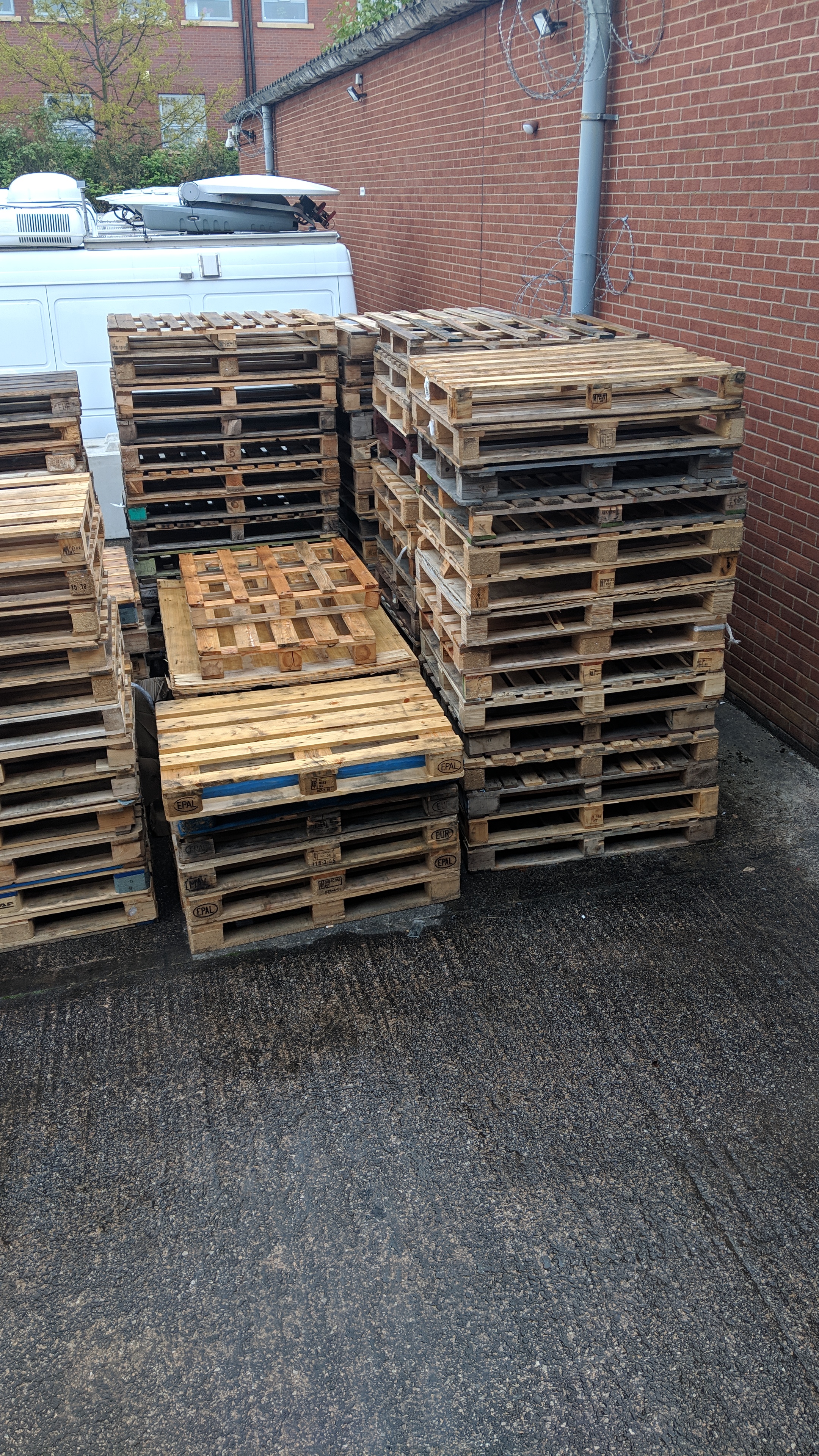 6 stacks of mostly full sized pallets, totalling approx. 74 pallets in ...
