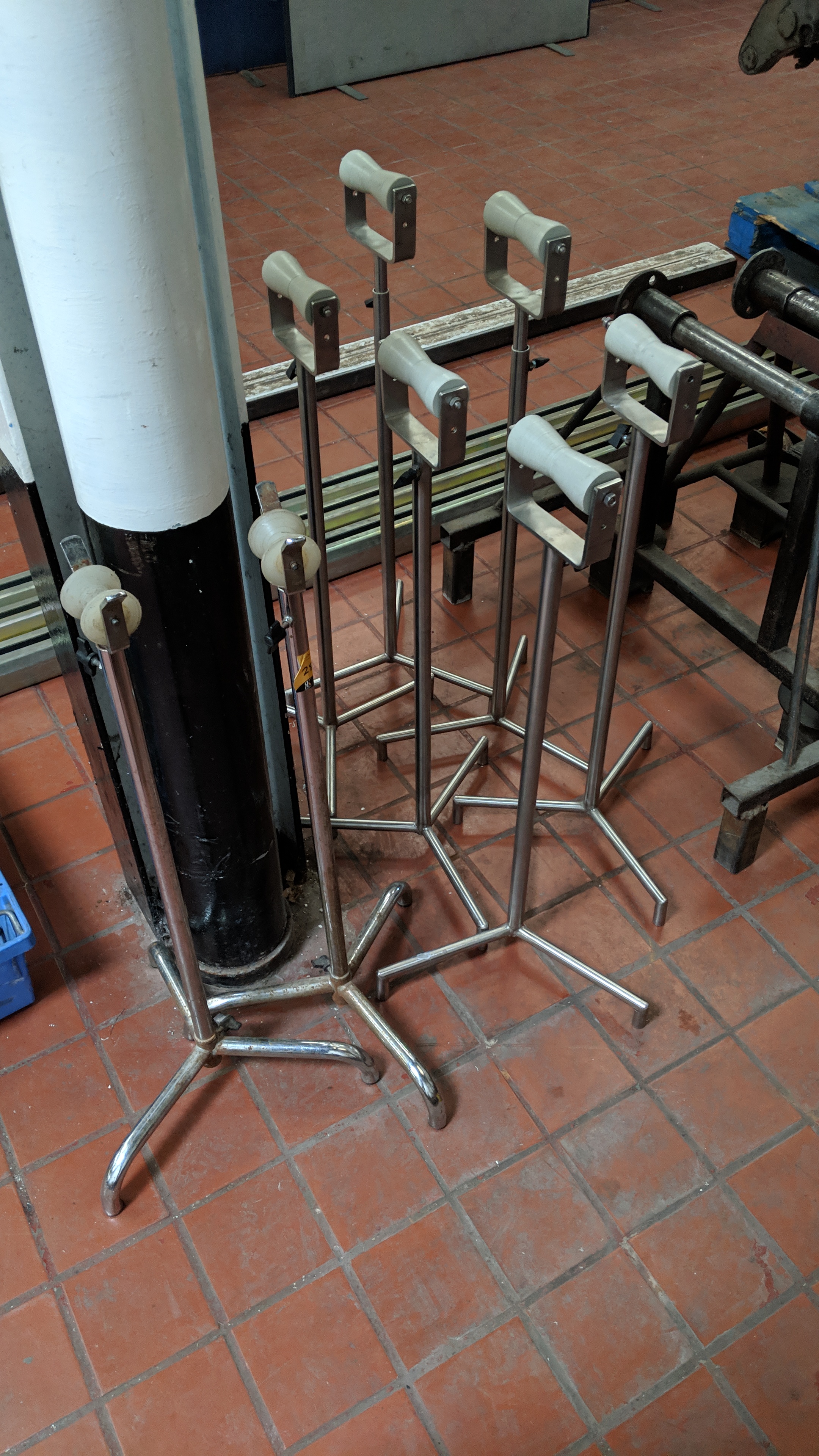8 off assorted tripod-based roller feed stands, with adjustable height ...