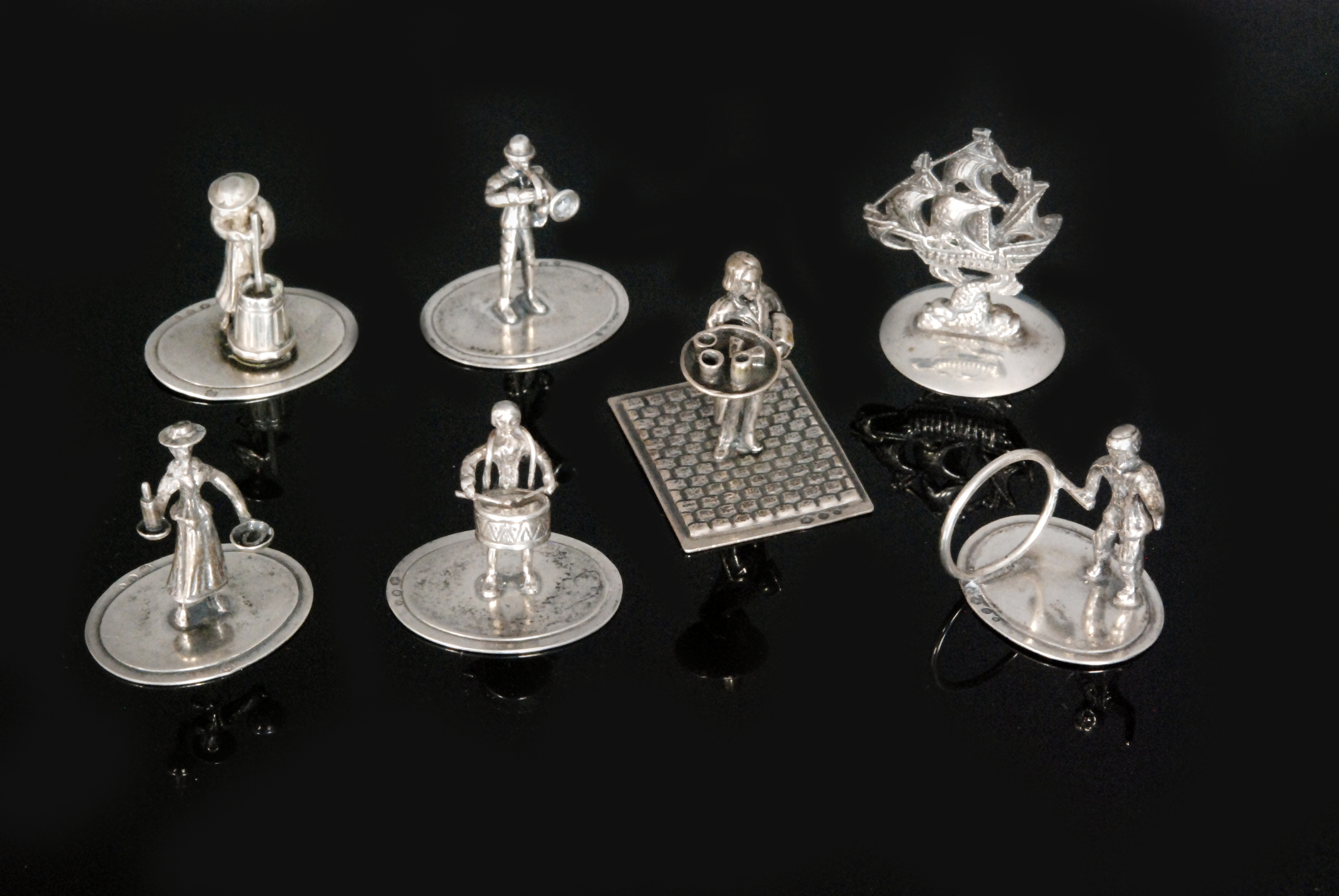 Four early 20th Century Dutch silver toys each designed as a model of a ...