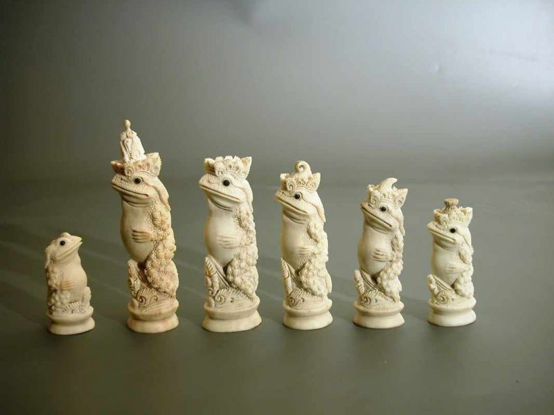 A bone chess set, Bali, depicting frogs. Ca. 1970. Herewith two other ...