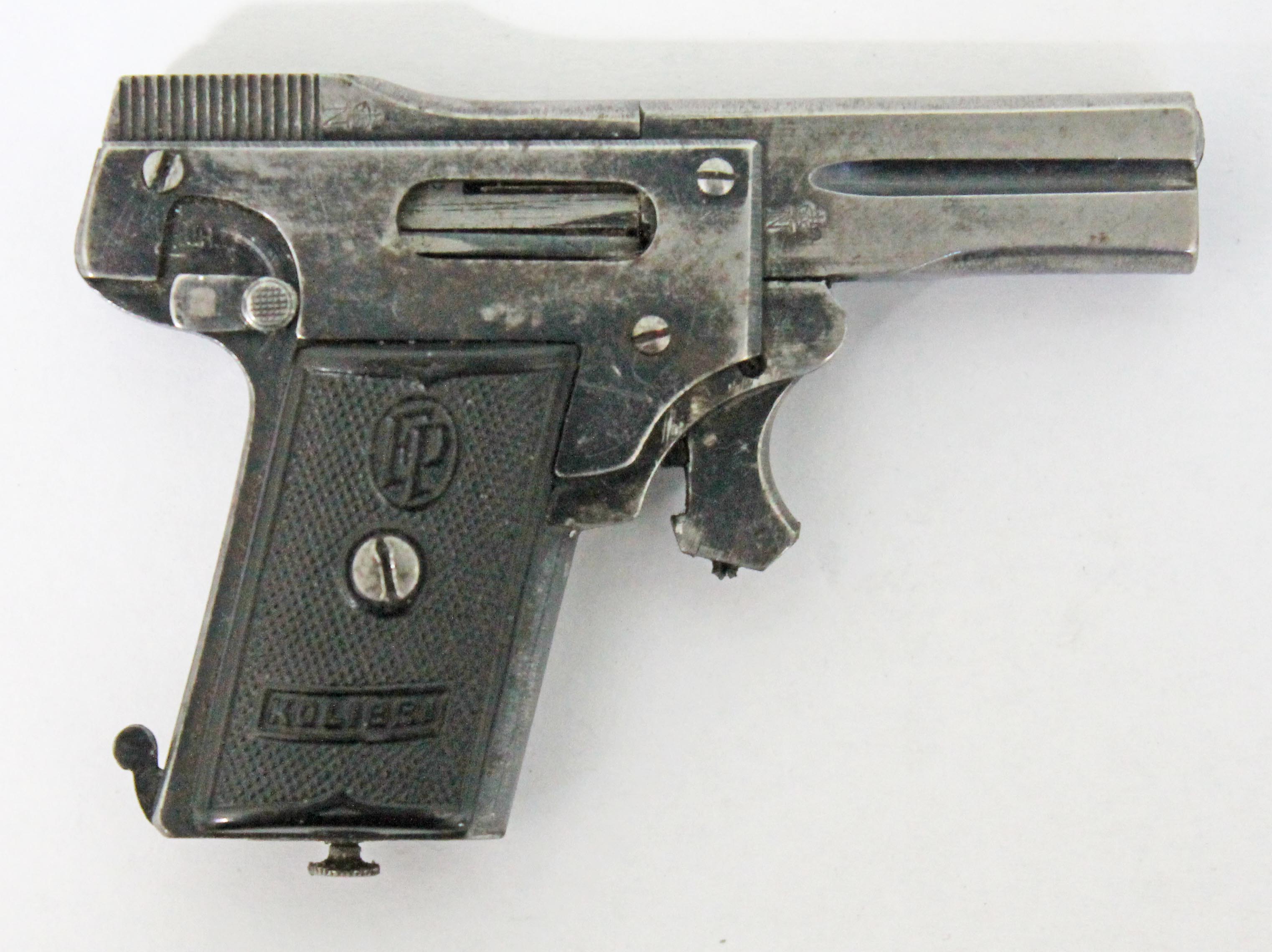 A Kolibri 2.7mm miniature semi automatic pistol.