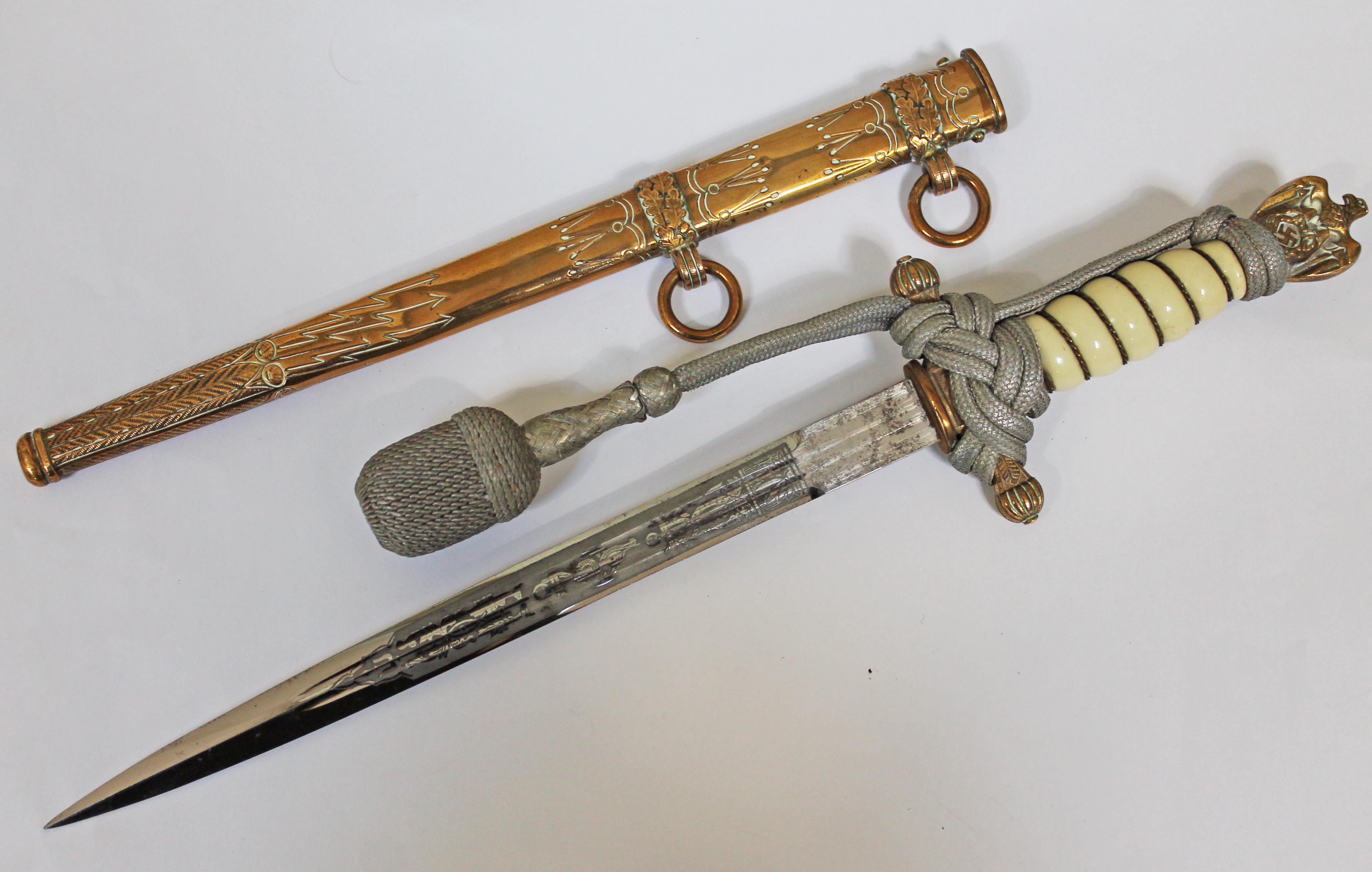 A Nazi Naval Officer's dress dagger with plastic wire bound grip, gilt ...