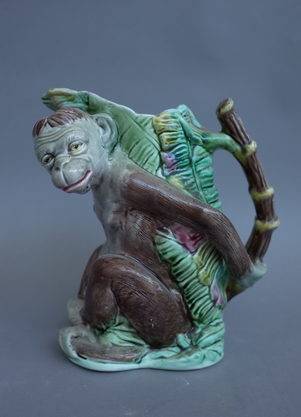 A majolica 'monkey' jug, late 19th/early 20th century, the monkey ...
