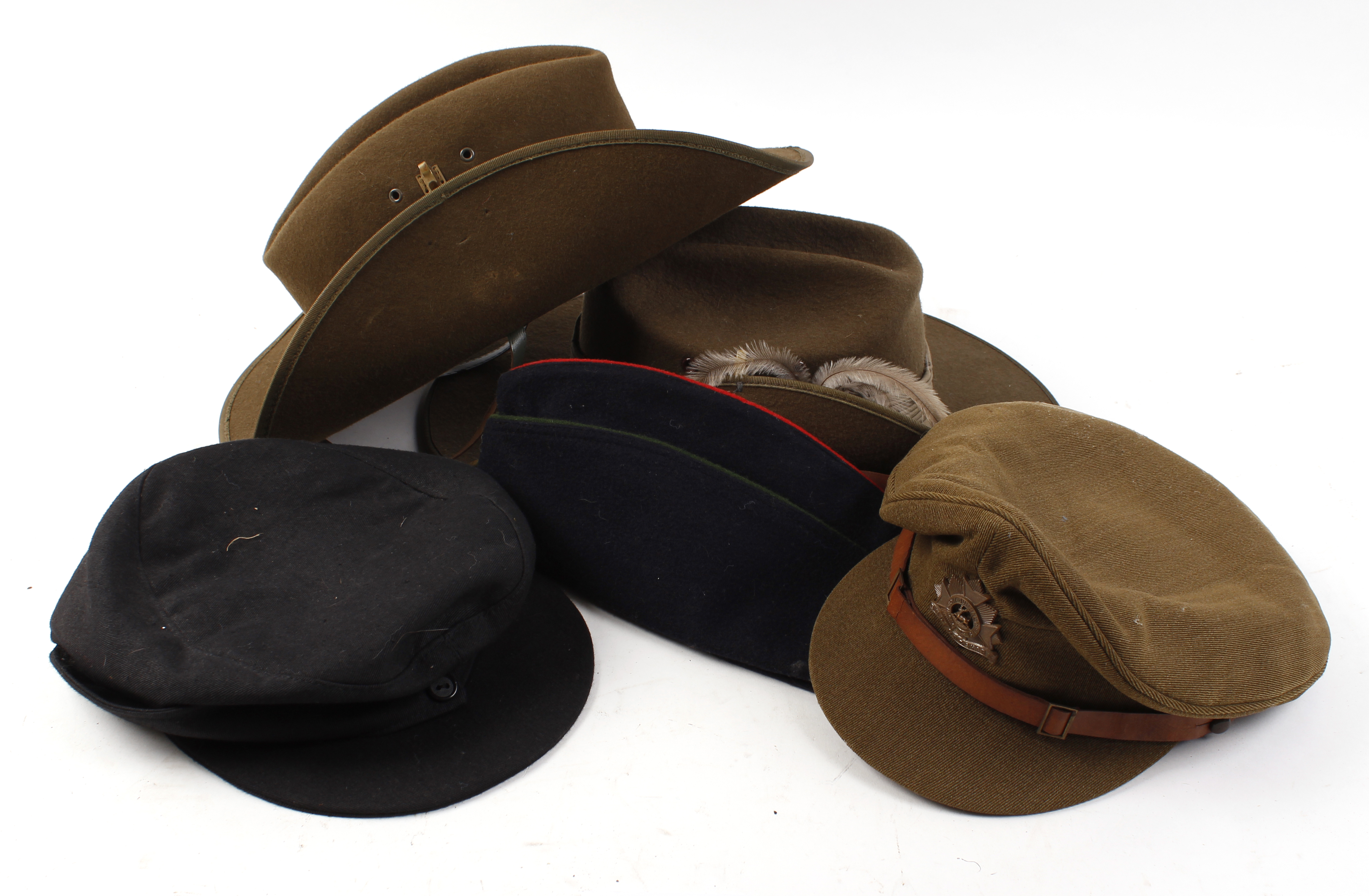 Two Australian military style bush hats and three other military caps