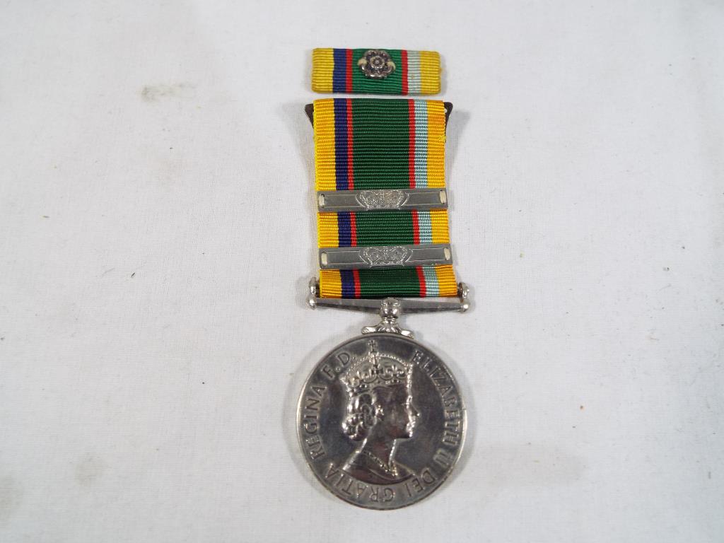 The Cadet Forces Medal with bars and ribbons inscribed to the rim Lieut ...