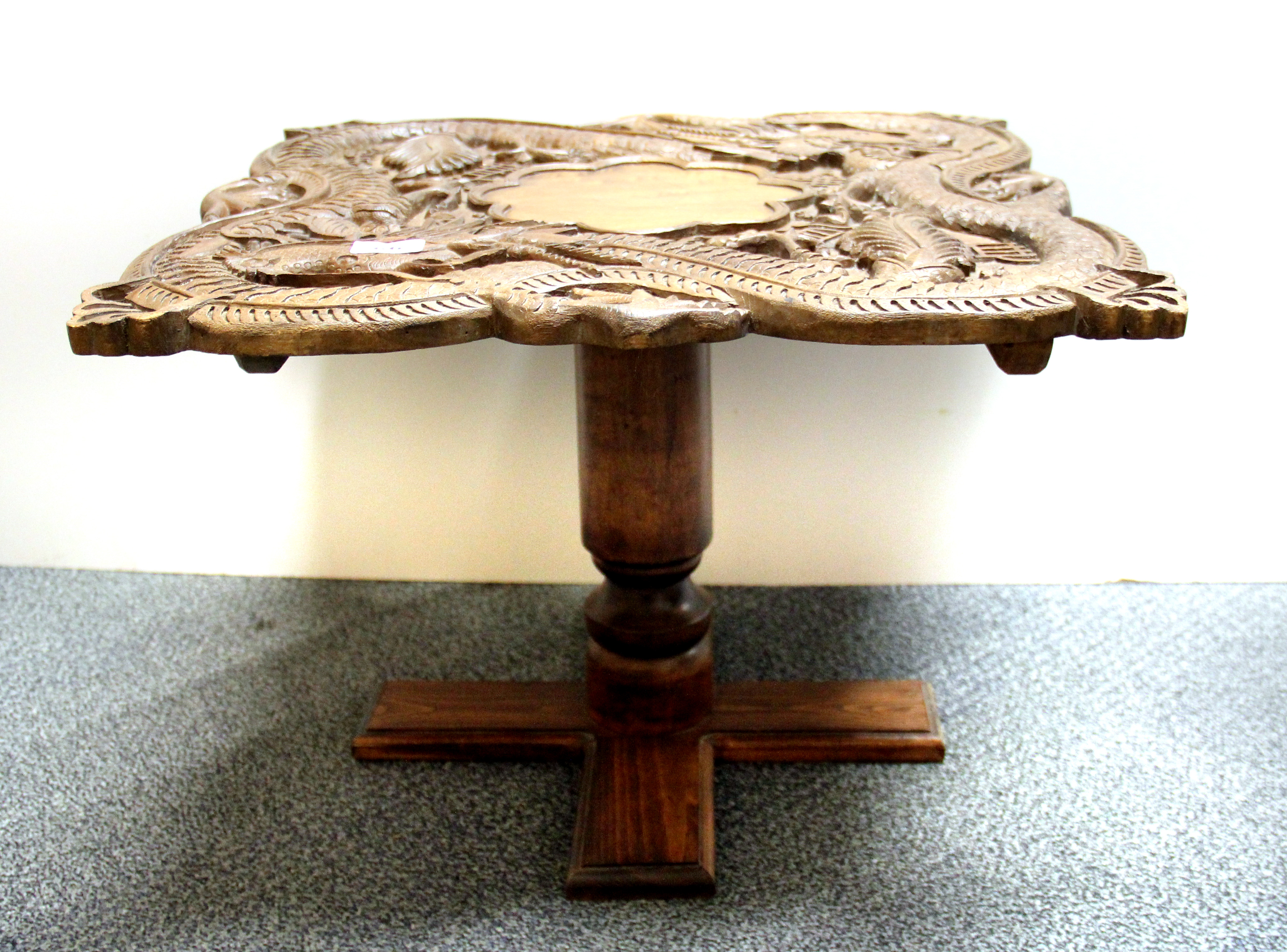 A mid 20th century Straits Chinese carved hardwood dragon table on a ...