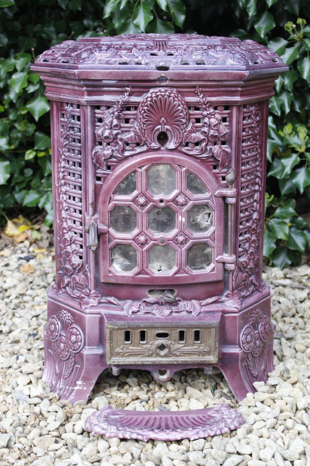 A FRENCH PURPLE ENAMEL HEXAGONAL WOOD BURNING STOVE with pierced ...