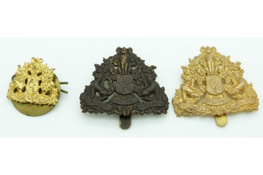 Three Burmese Army metal cap badges and a collar badge, two by Firmin ...