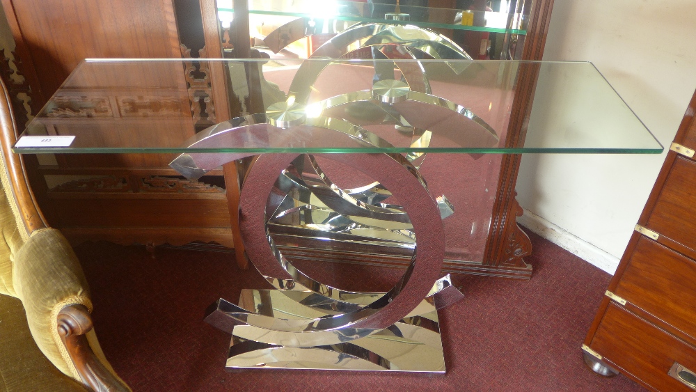 A Coco Chanel console table, the rectangular hardened glass plate top ...