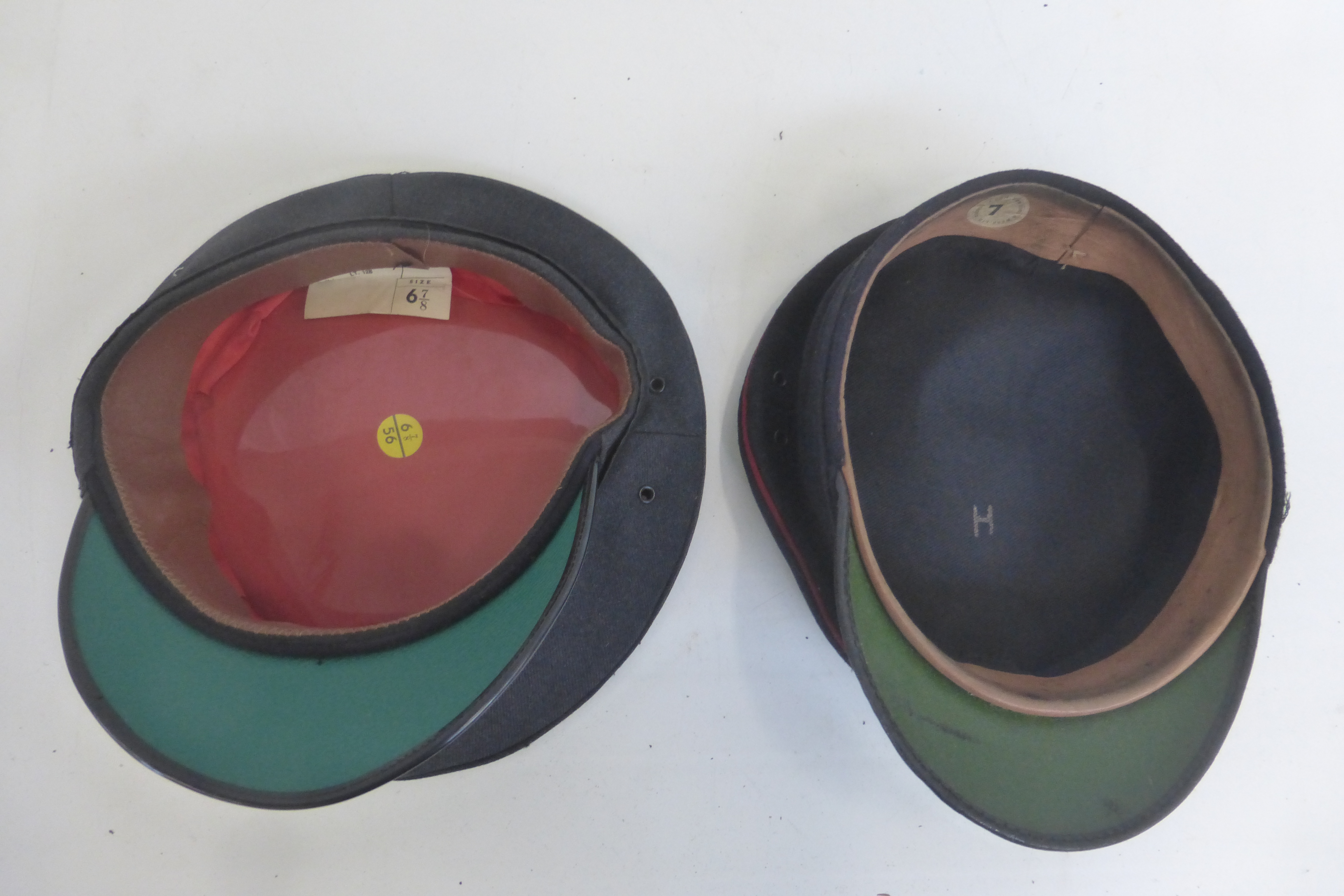 A London Transport cap, size 6 7/8" with part enamel badge to the front ...