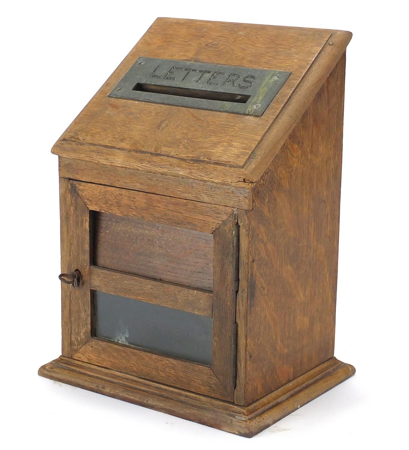 Edwardian oak letter box with hinged front having a brass 'Letters ...